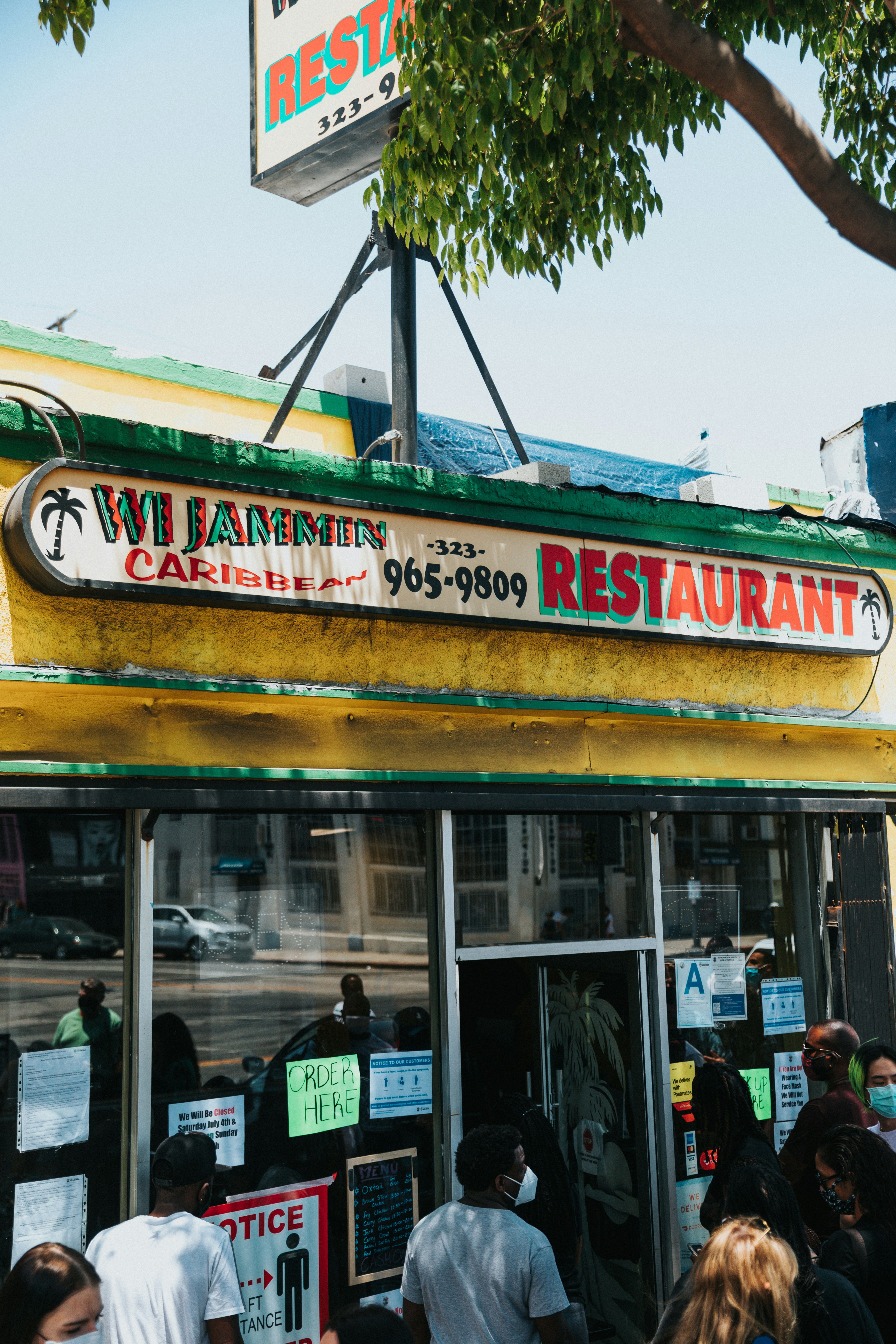 Yellow and red store signage photo – Free Human Image on Unsplash