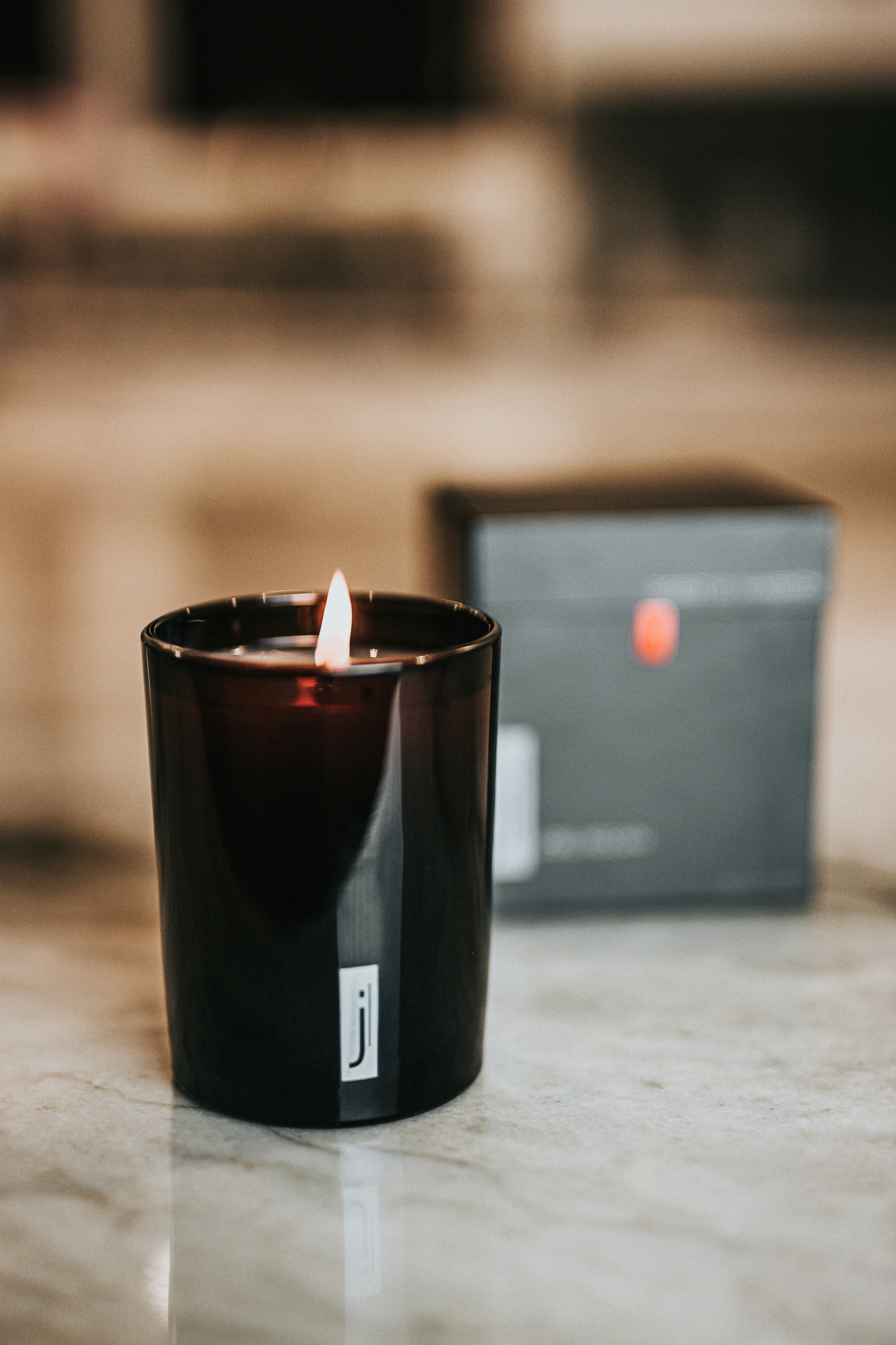 Midday Glow: A Single Candle Amid Quiet Luxury