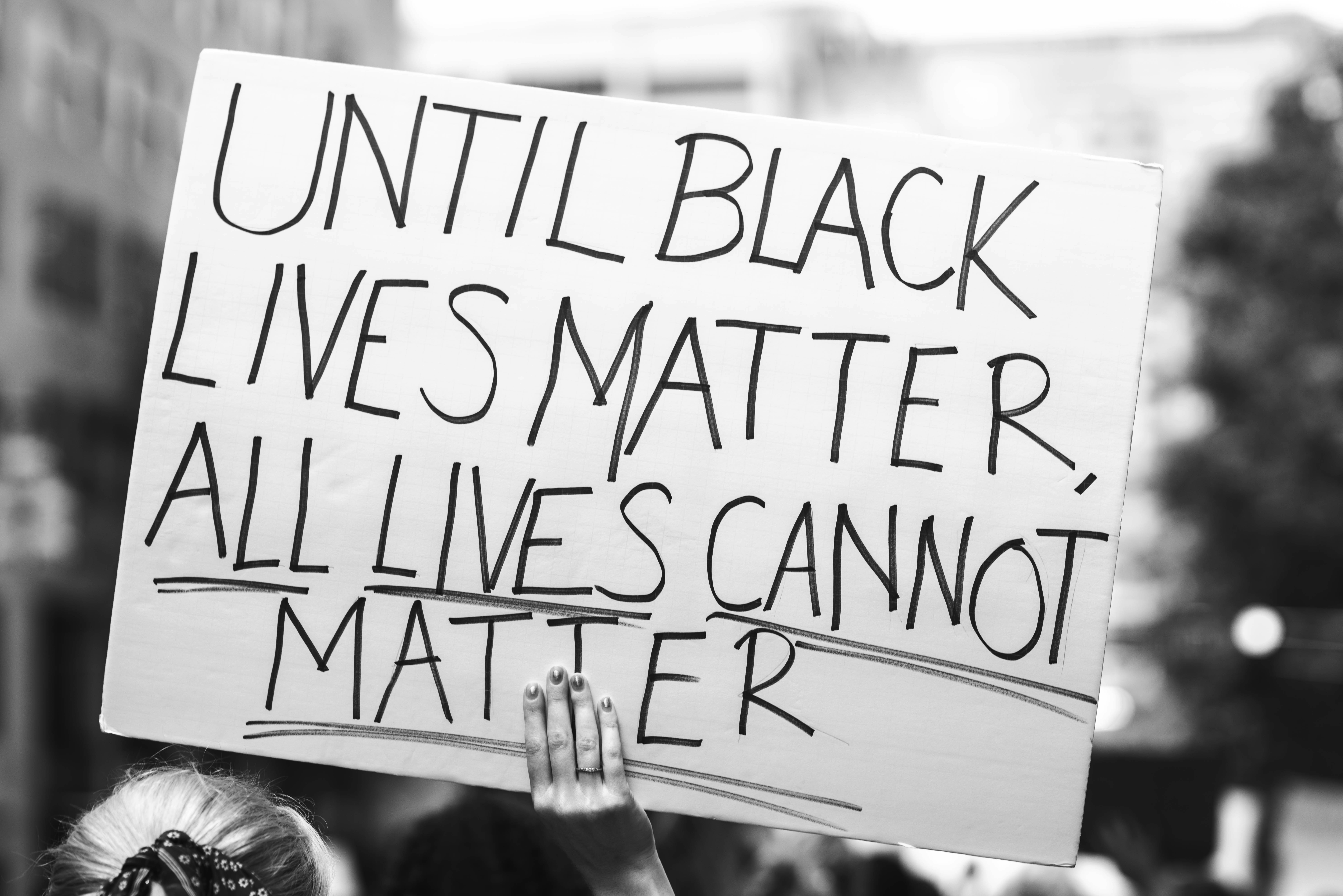 Until Black Lives Matter Sign: A Monochrome Protest Portrait