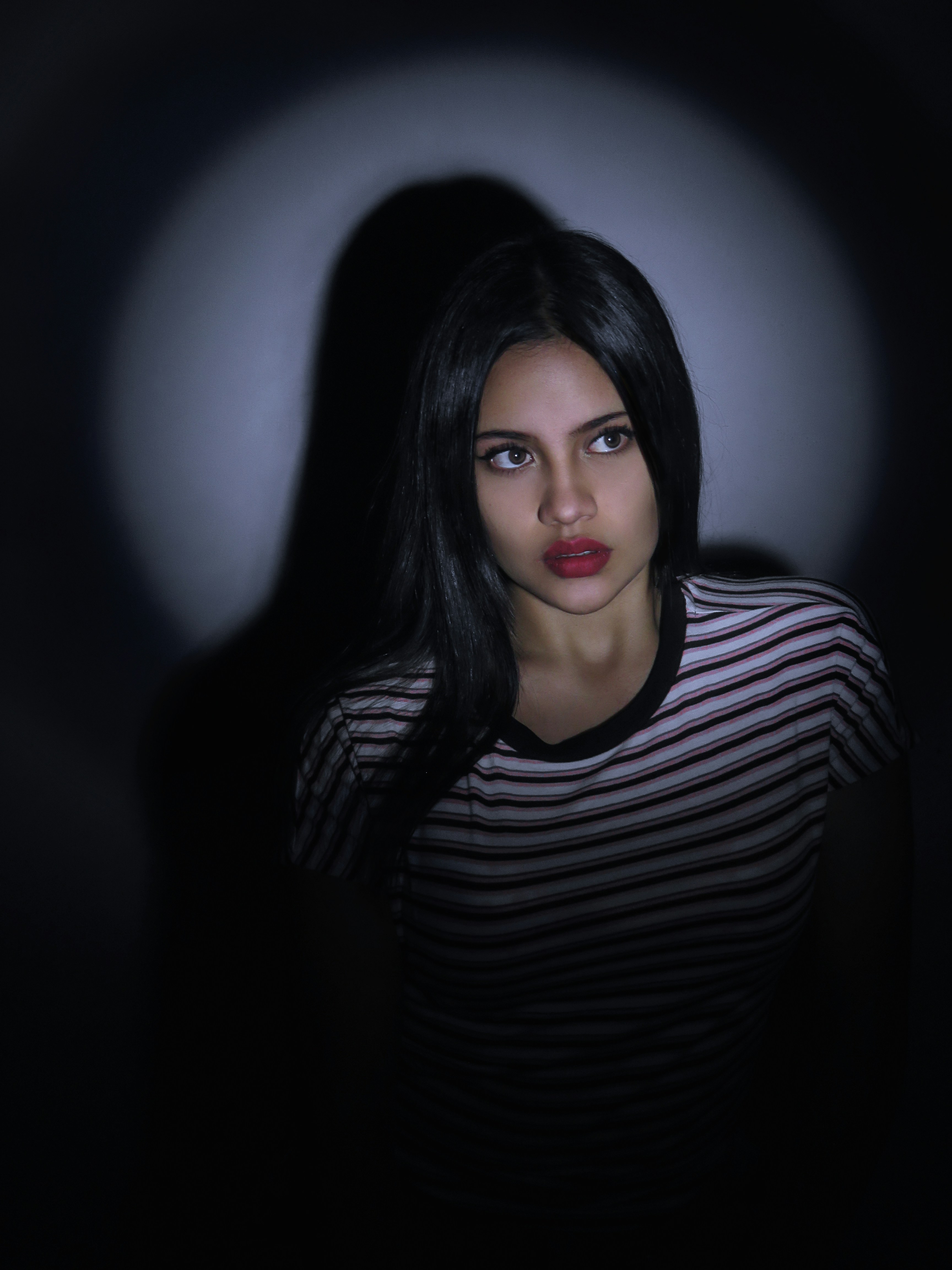Halo Portrait: A Narrow Beam Illuminates a Quiet Gaze