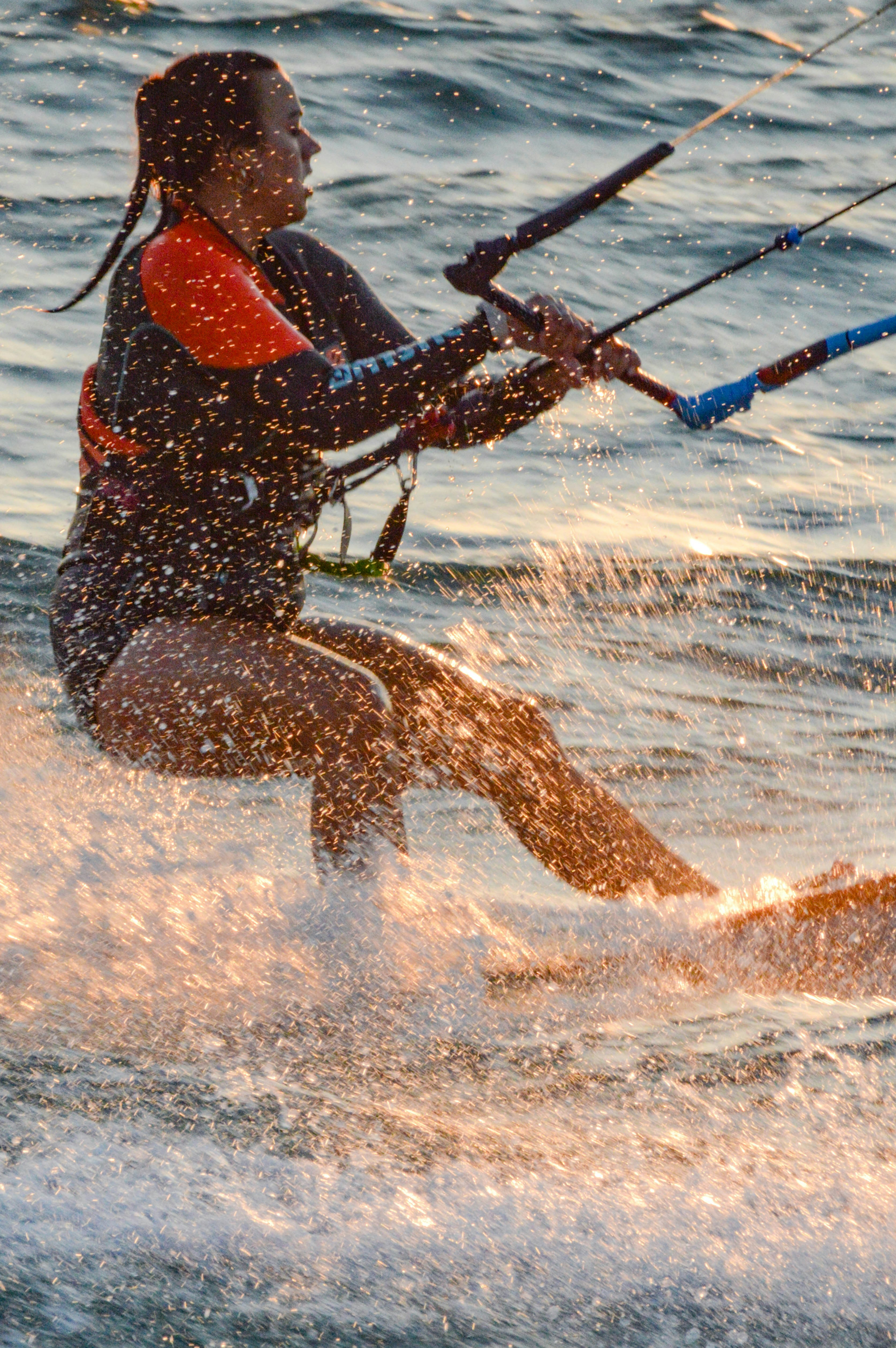 Waterborne Winder: Windsurfer Routs Spray in Golden Light