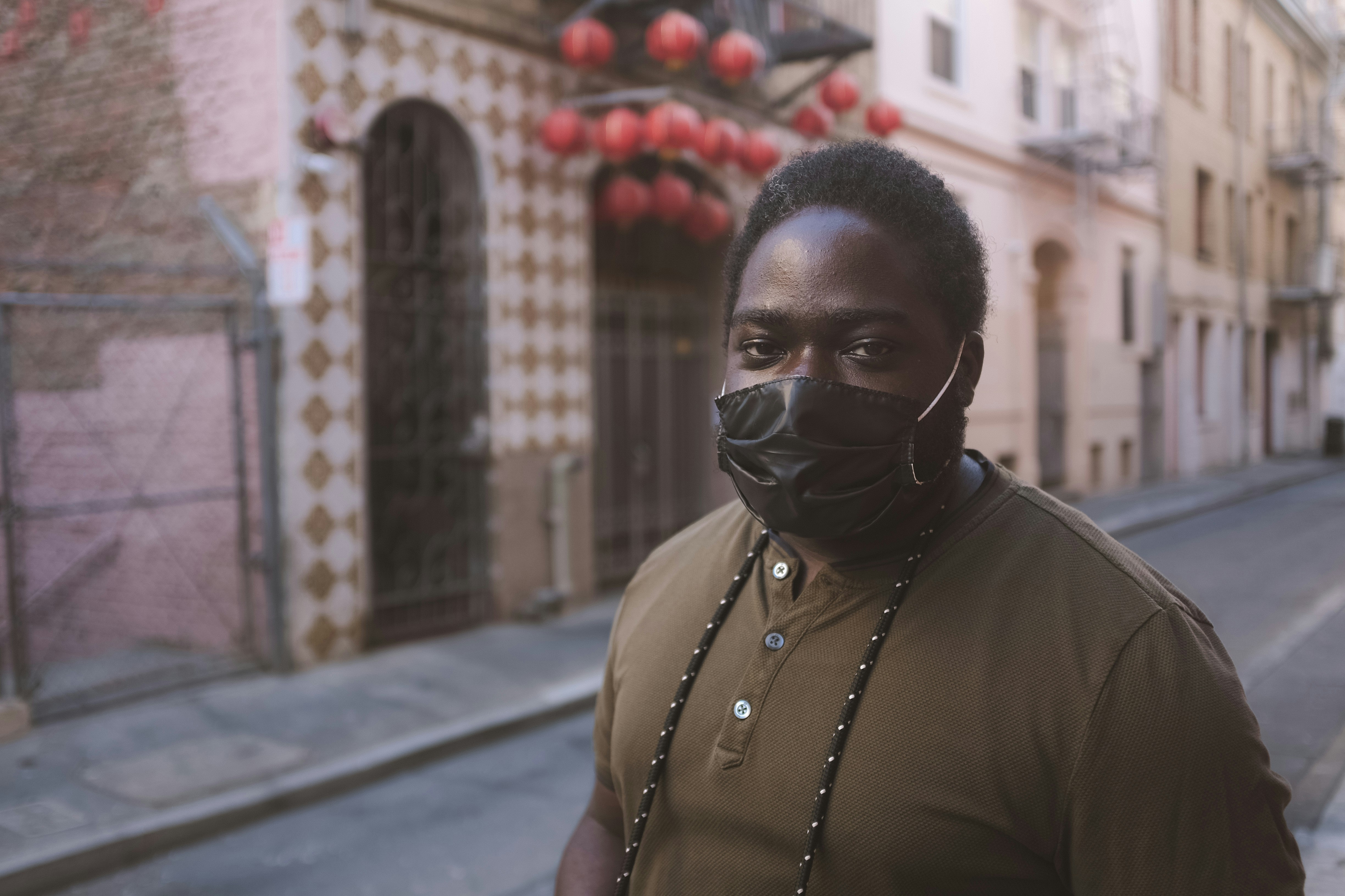 Masked Portrait on a Lantern-Lined Street