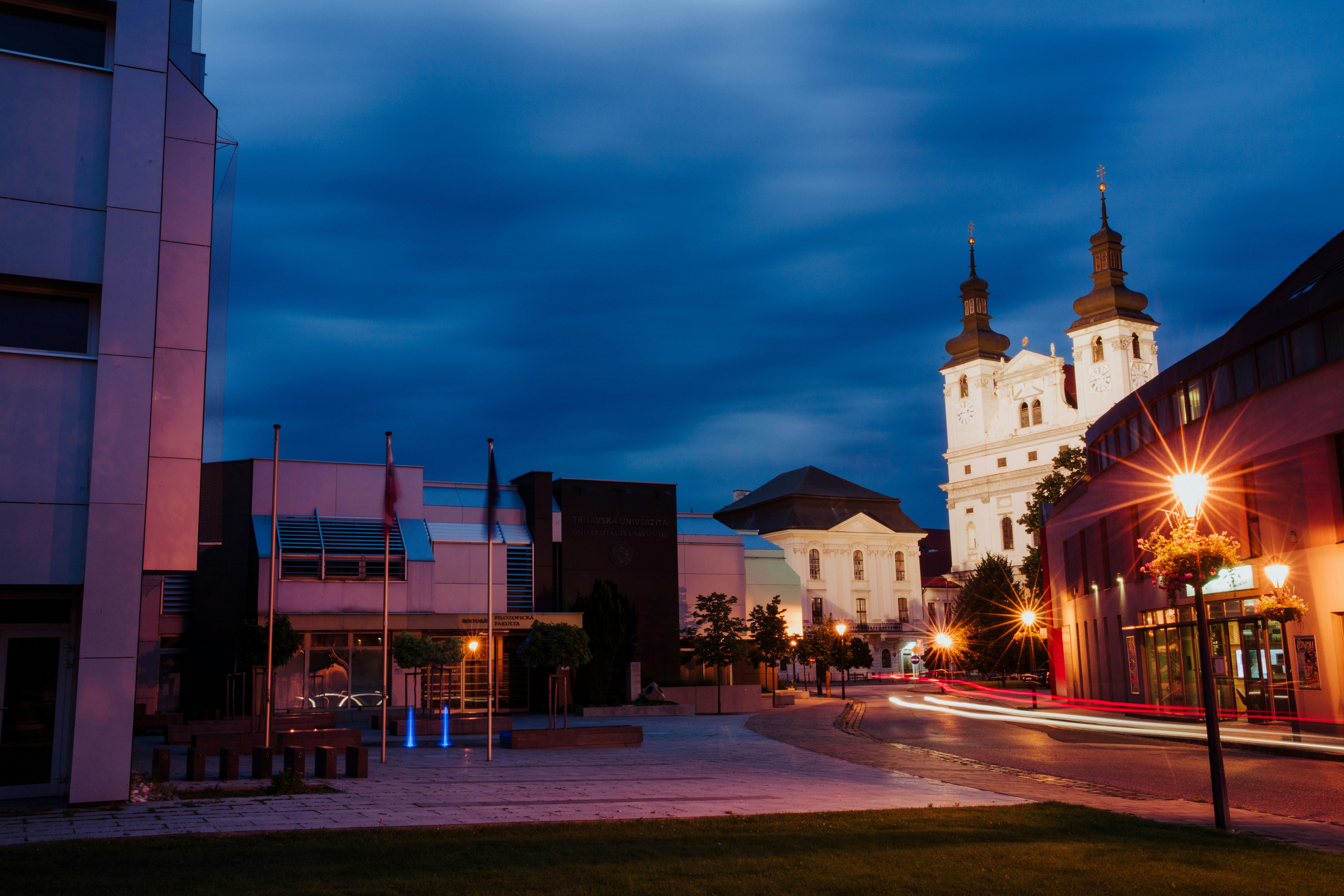 Blue Hour Spires: Neon Trails and Quiet City Streets