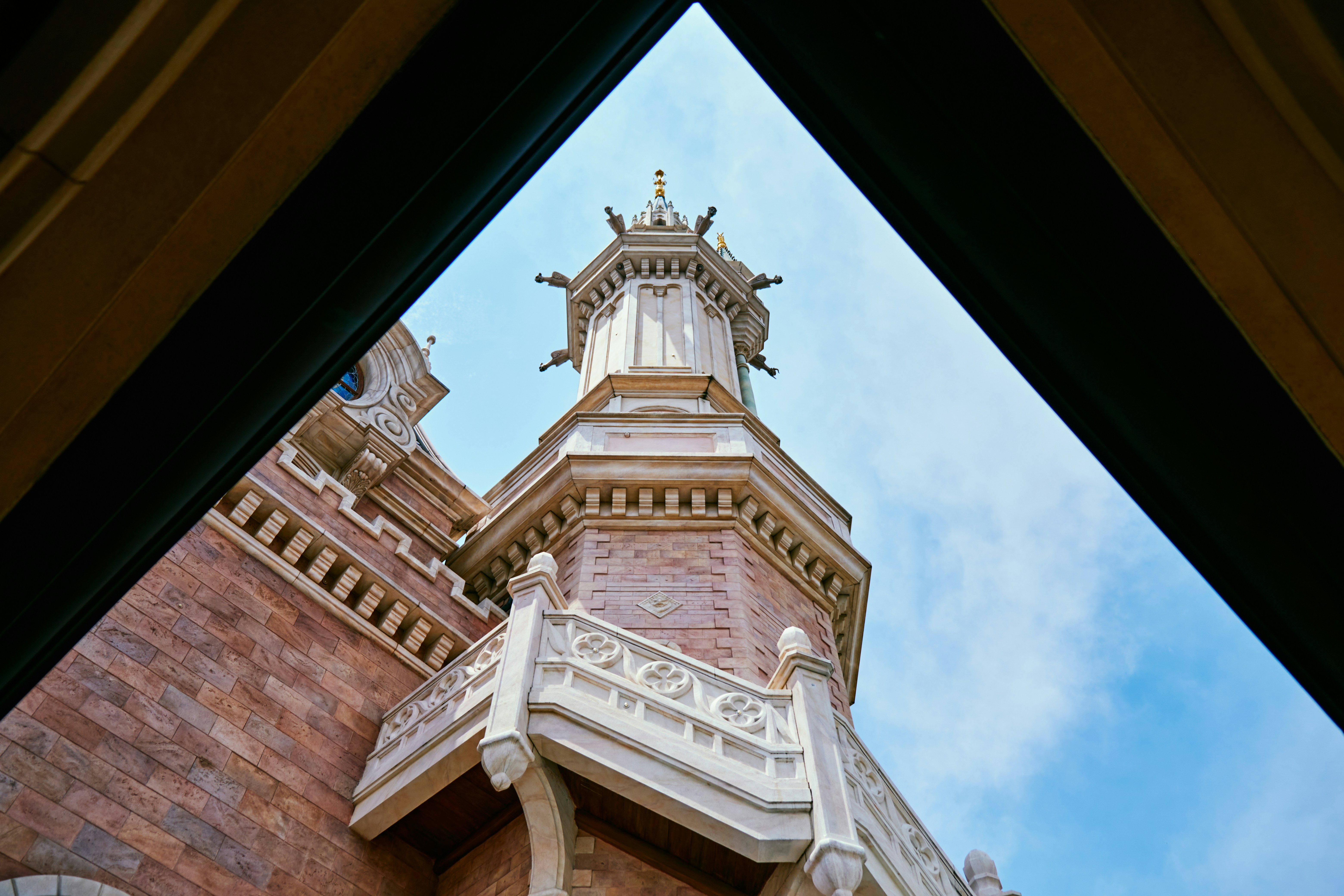 Archway Framing a Brick Turret Reaching Toward the Sky