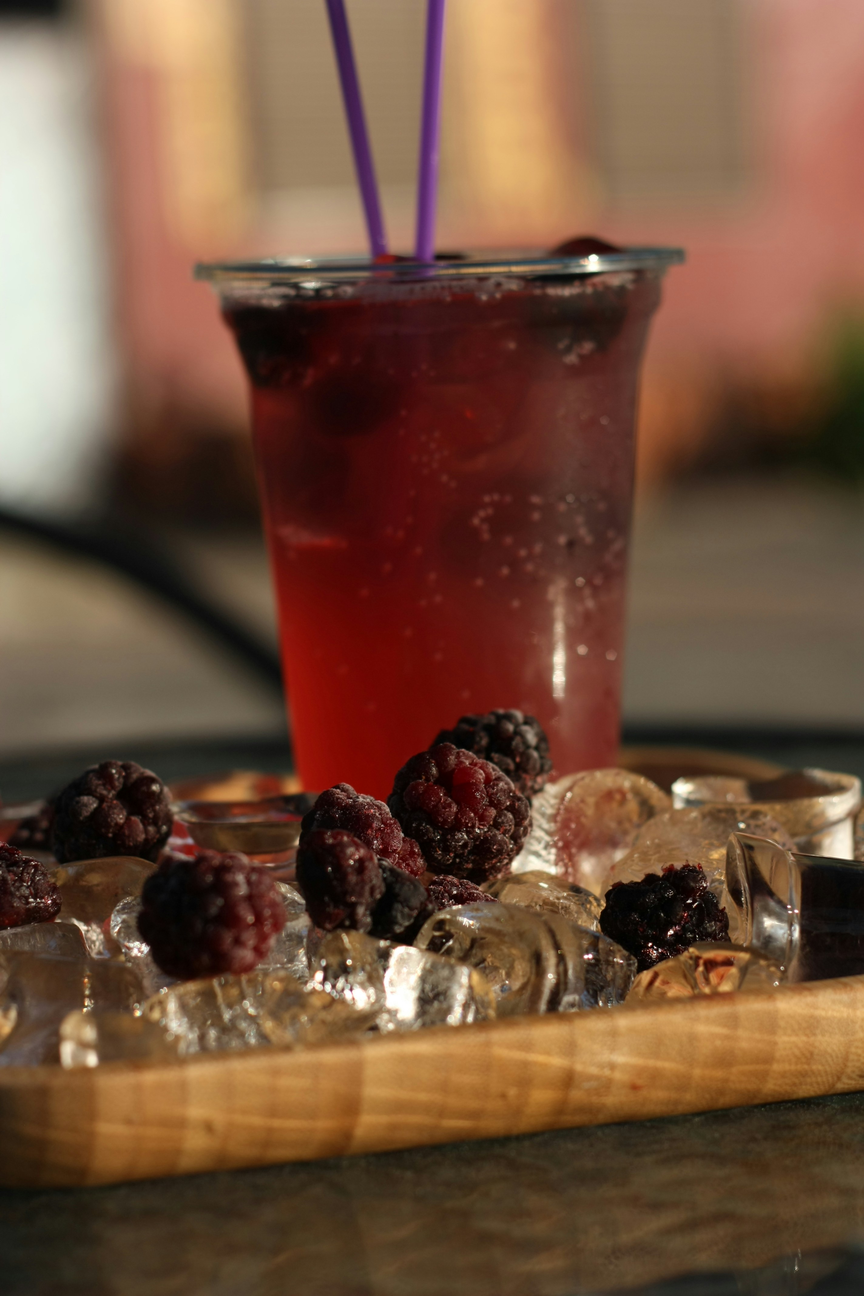 Crimson Cooler Under Violet Straws: Ice, Berries, and Soft Backlight