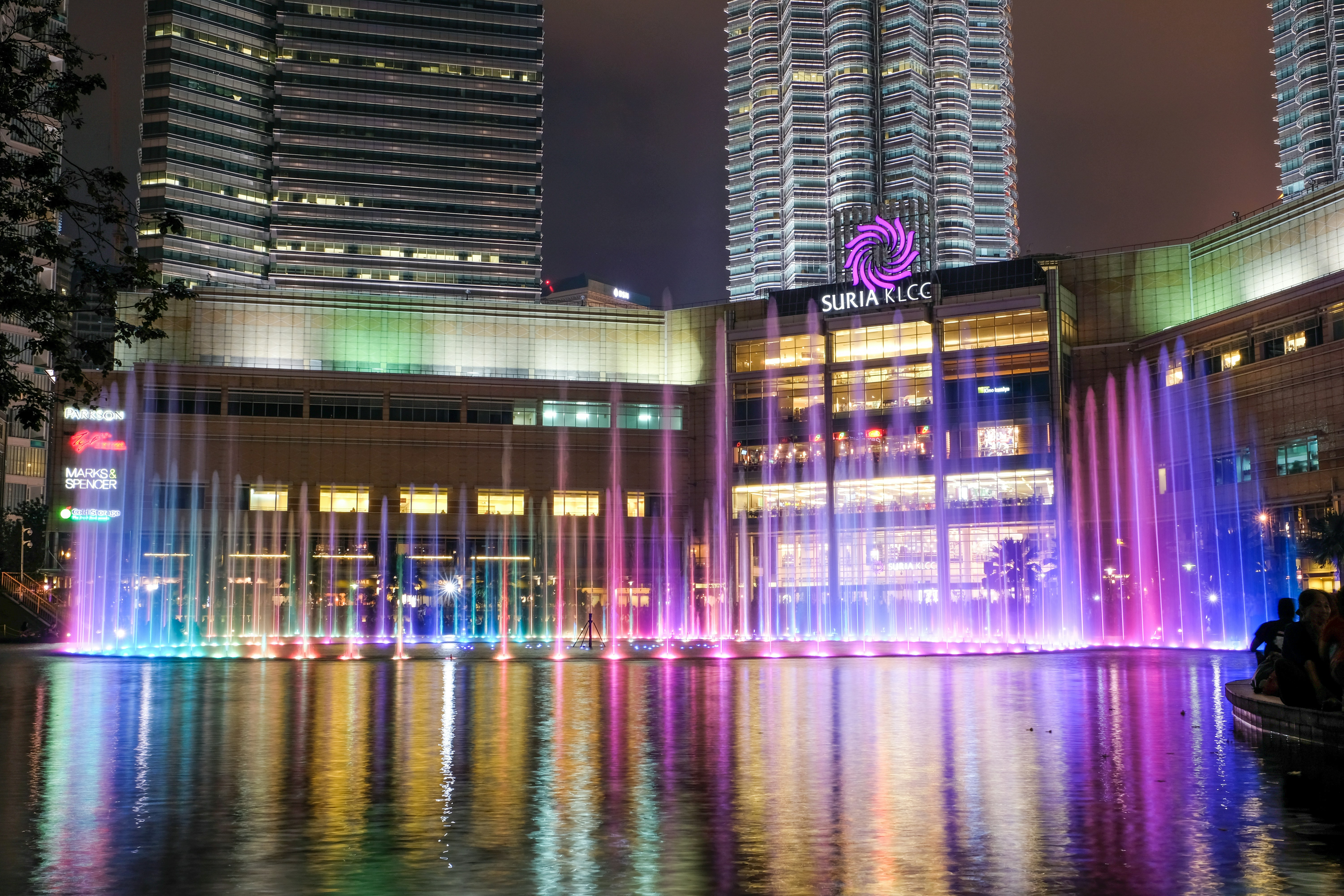 Neon Cascade at Suria KLCC: Reflections in Night Light