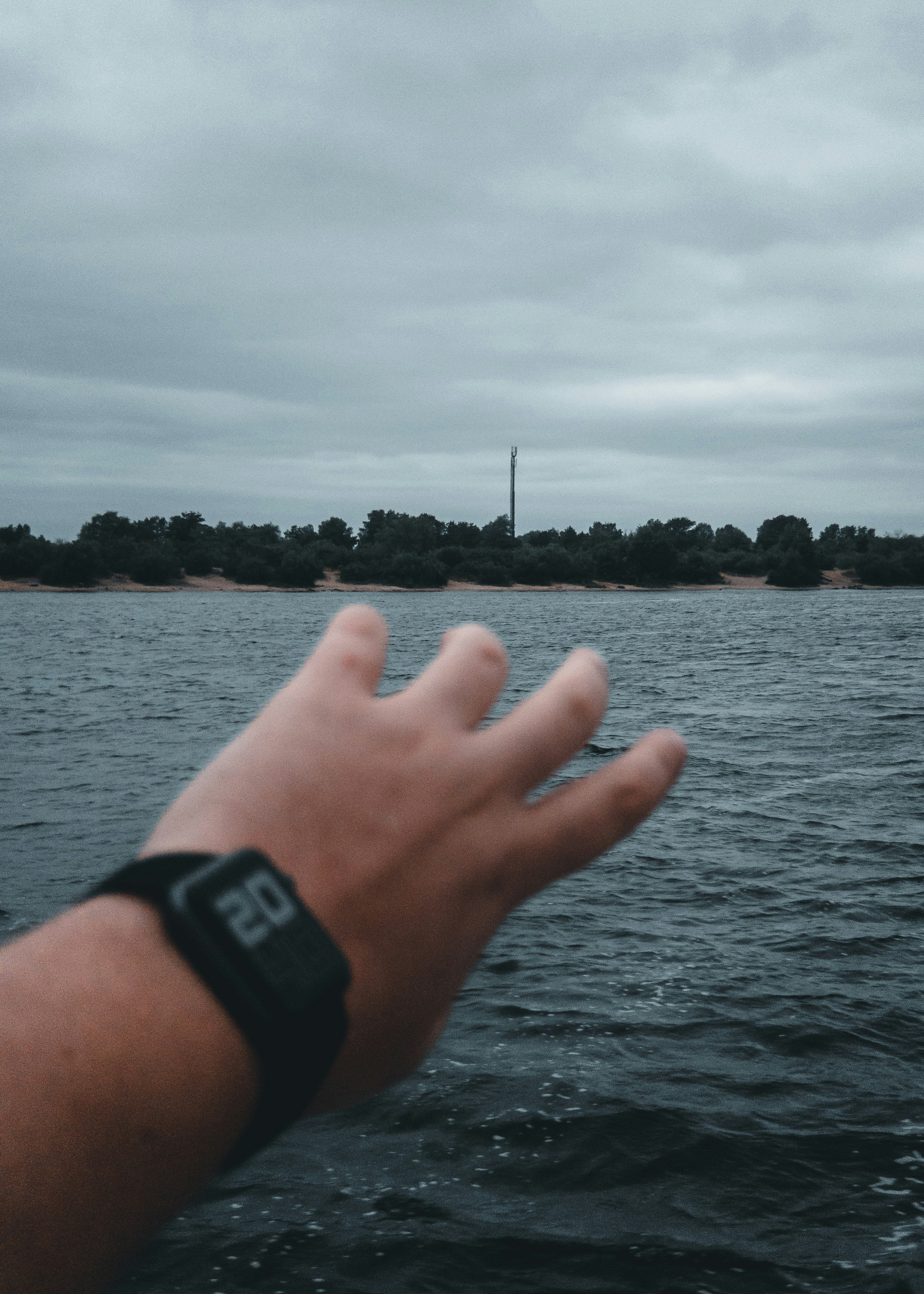 Gesture Toward the Distant Mast Across a Cloudy Shore