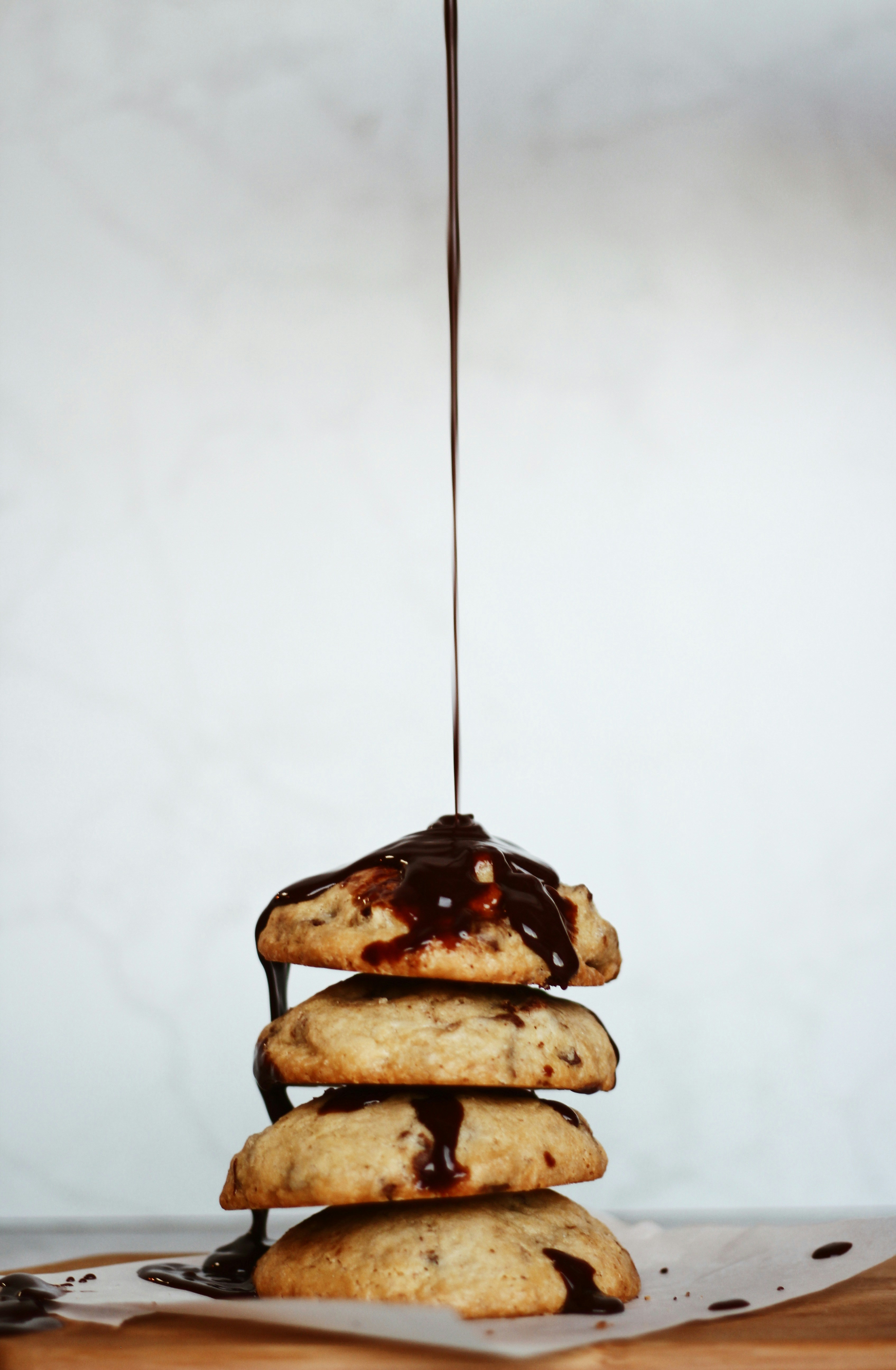 Sticky Chocolate Cascade: Stack of Cookies Drenched in Syrup