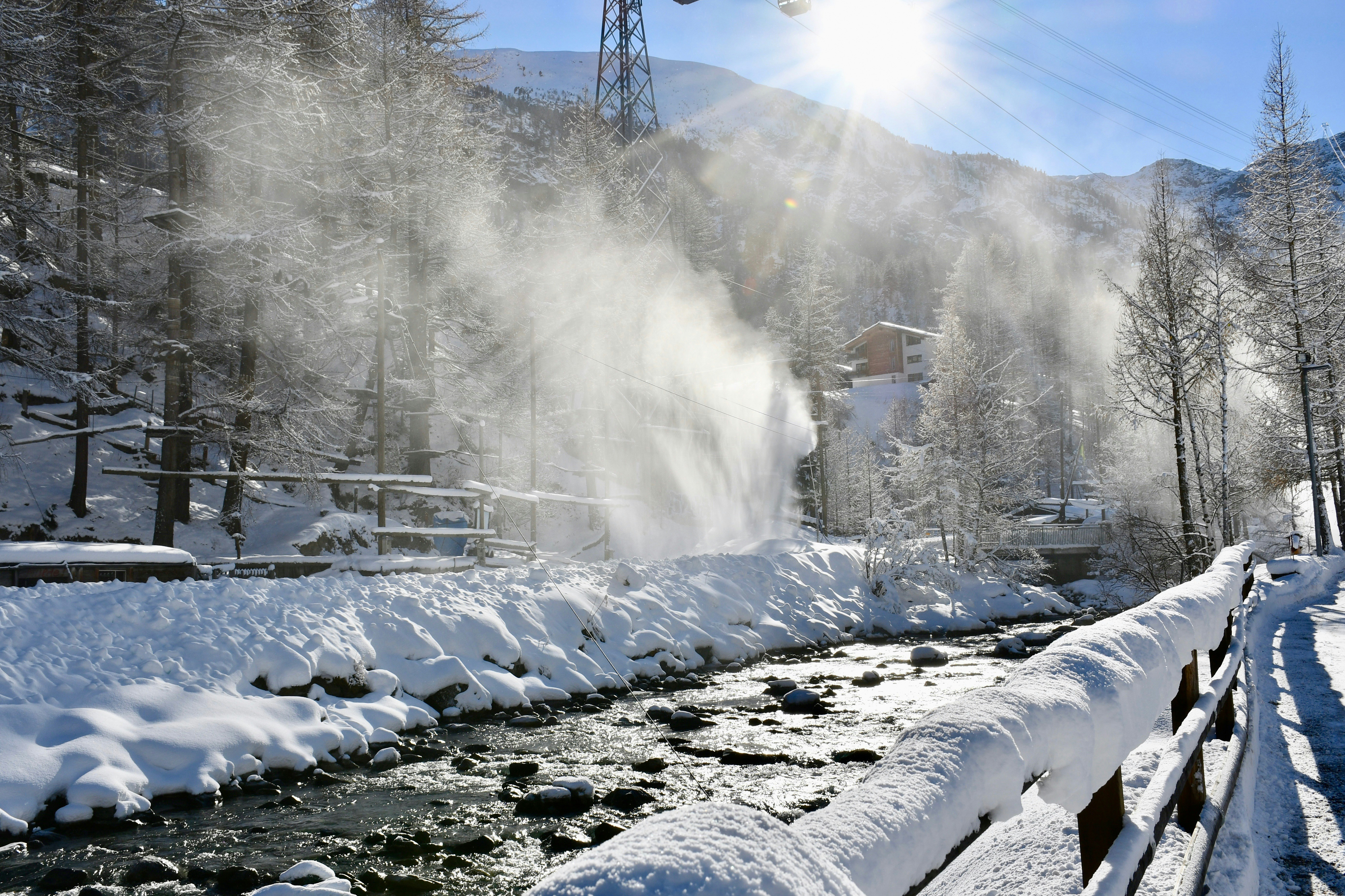 Sunlit Steam Over a Frosted Alpine River