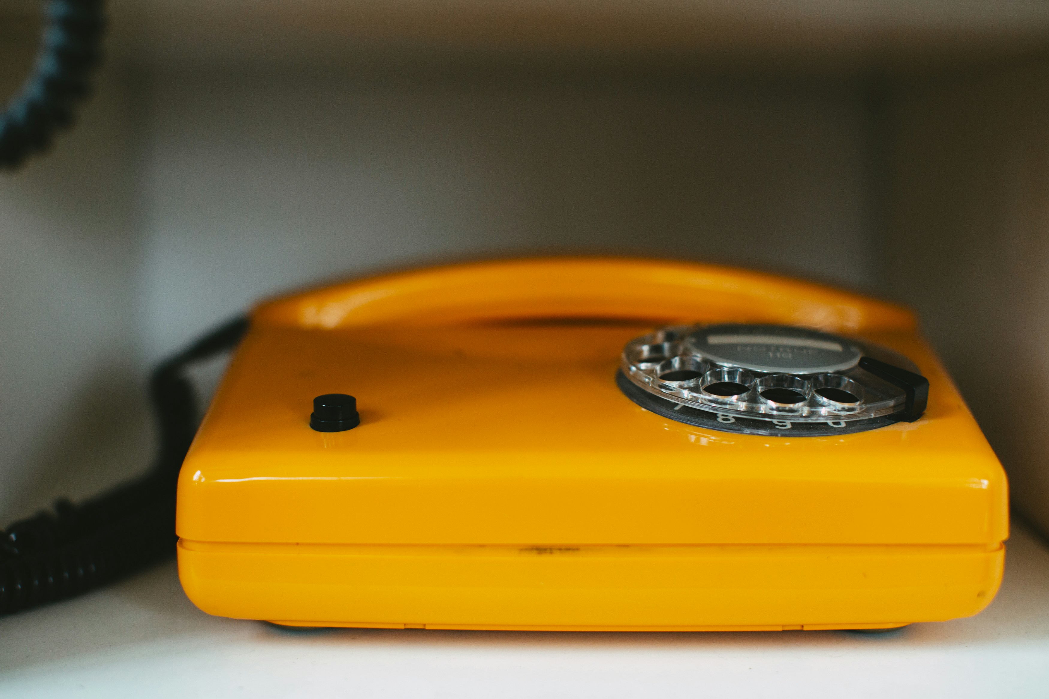 Orange Control Box with Chrome Dial: A Quiet Shelf Portrait of Industrial Design