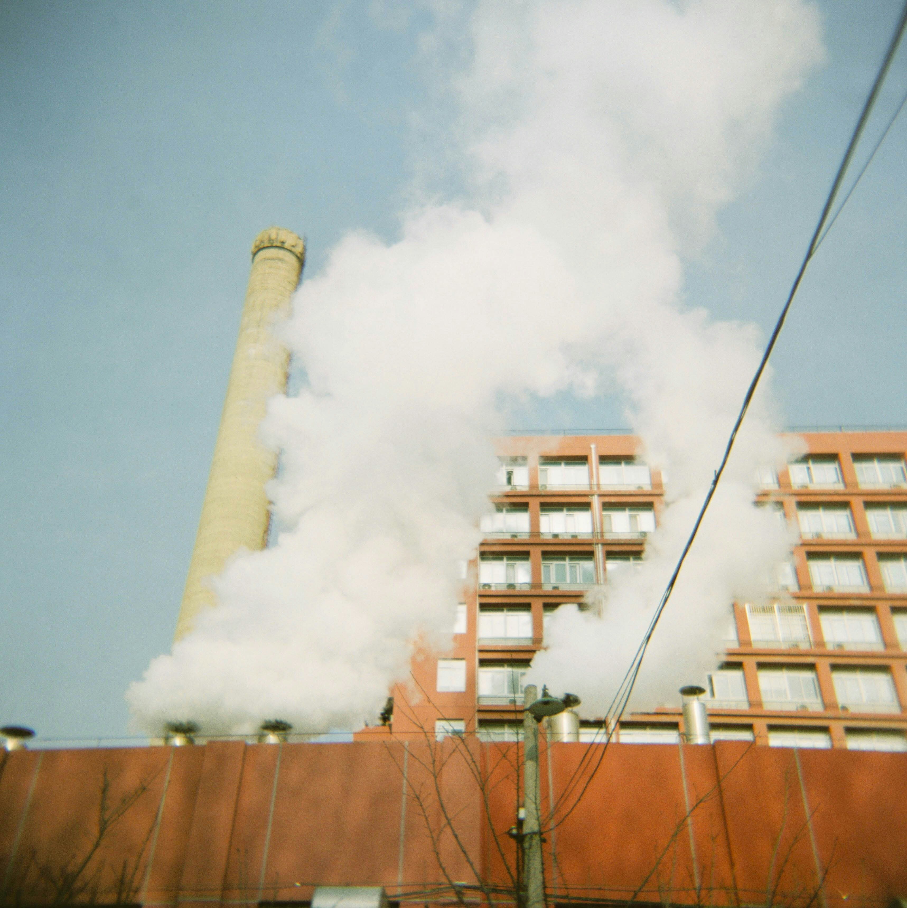 Vertical Breath Over Red-Brick Towers