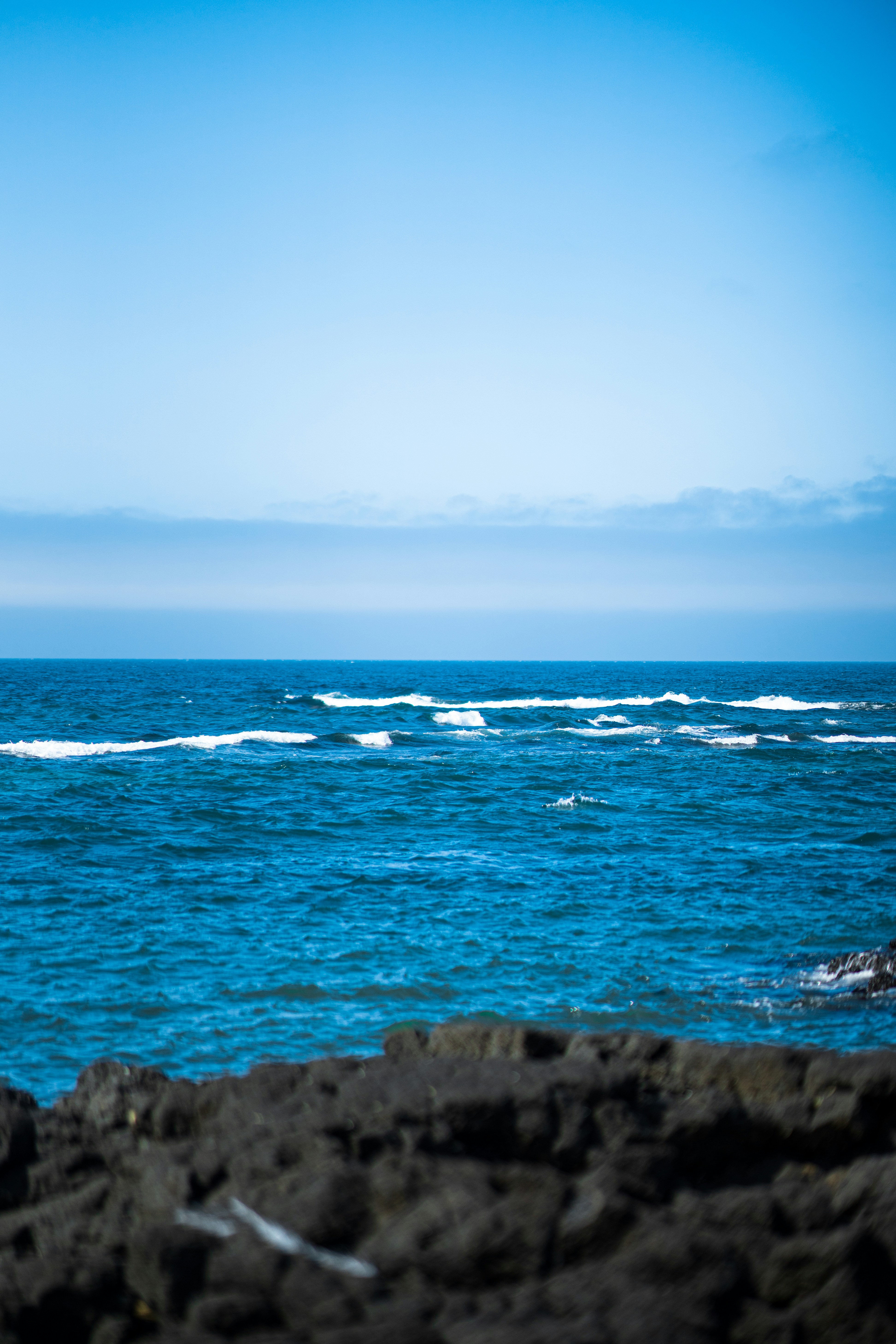 Azure Horizon Over Rugged Shore
