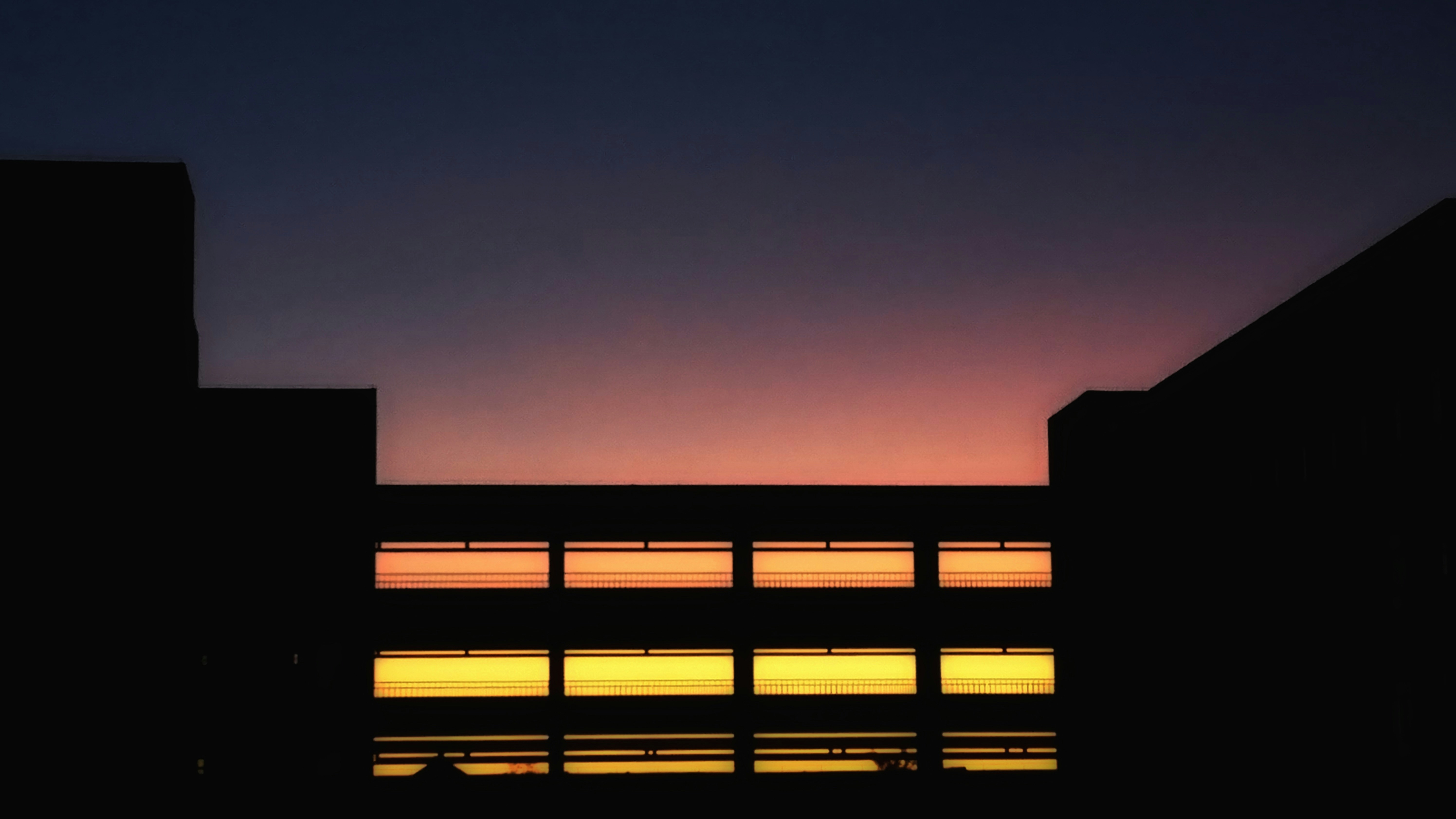 silhouette of building during sunset