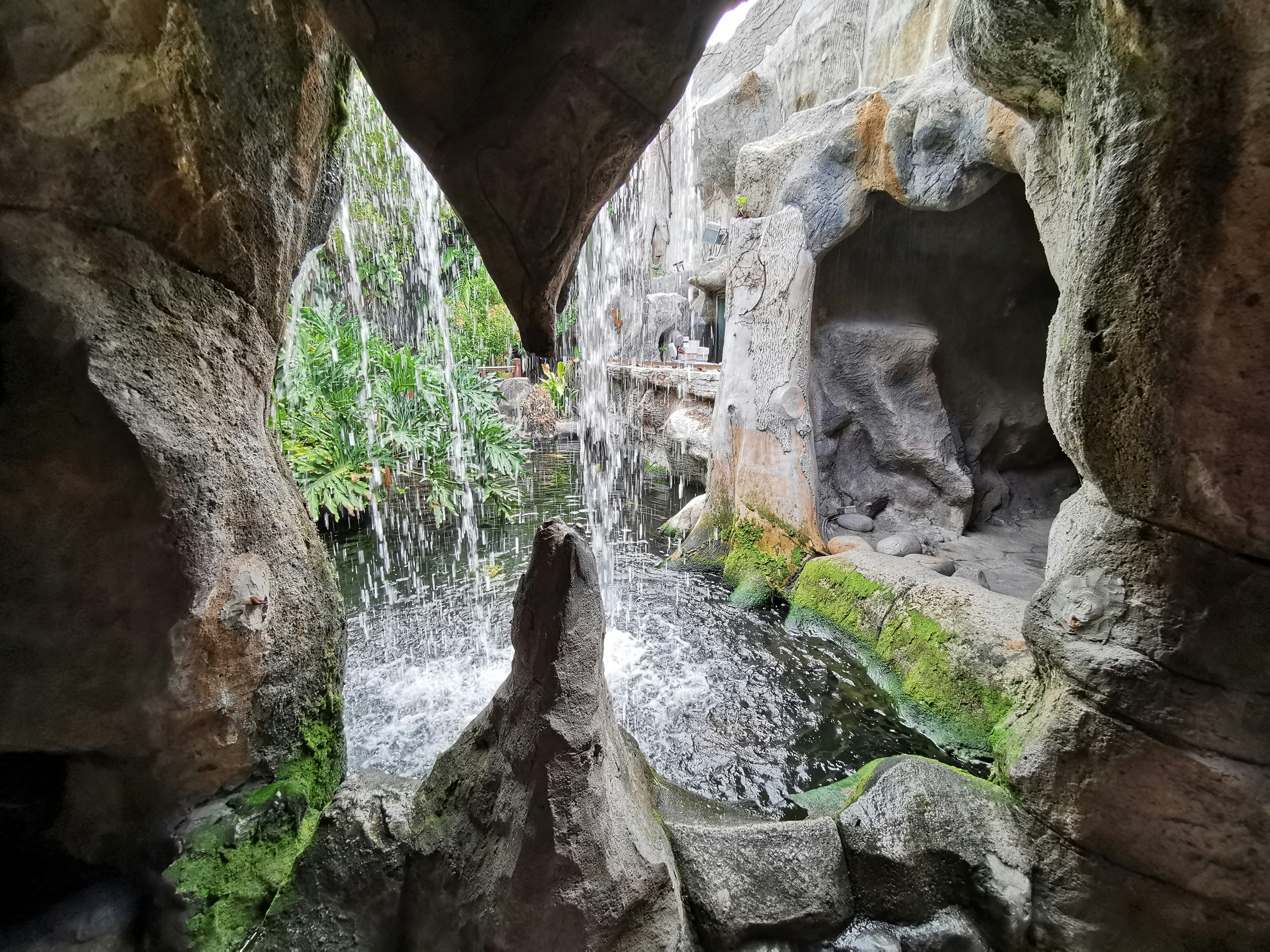 gray rock formation near body of water during daytime