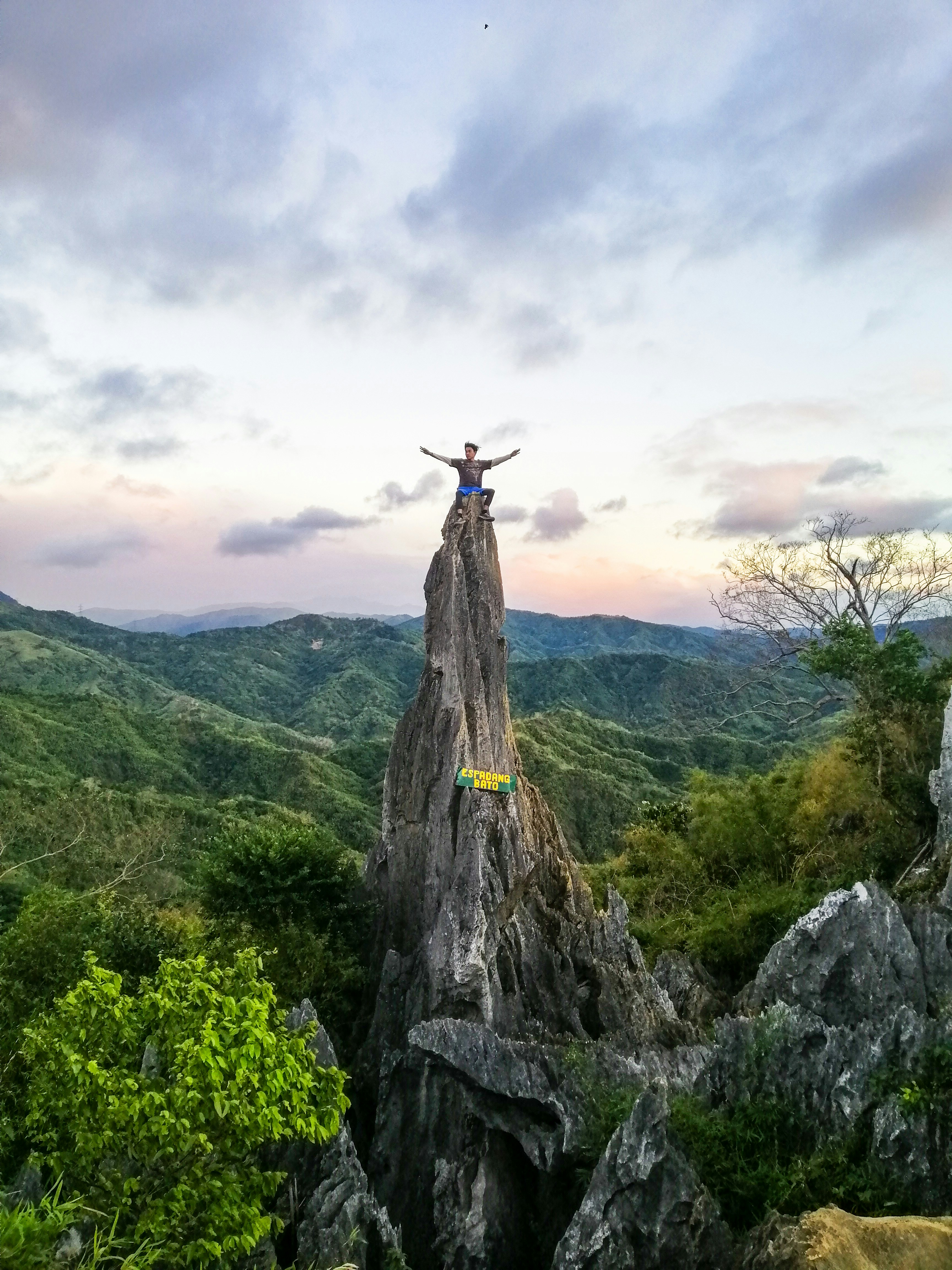 A man sitting on amazing rock formation