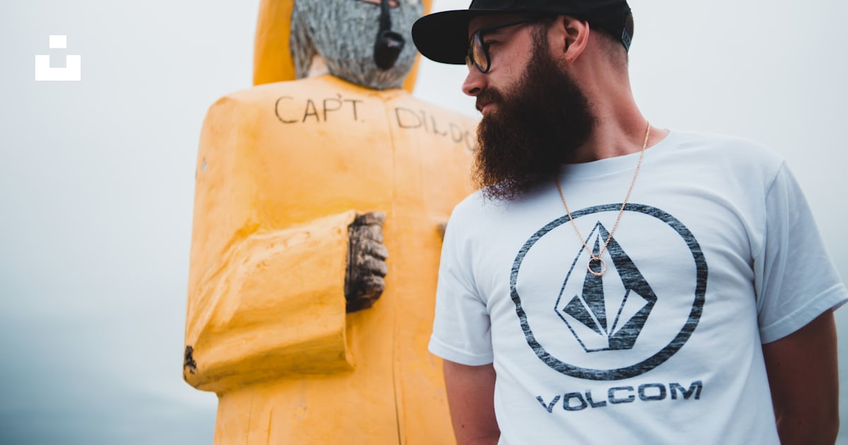 Man In White Crew Neck T Shirt Wearing Black Cap Photo Free Blue