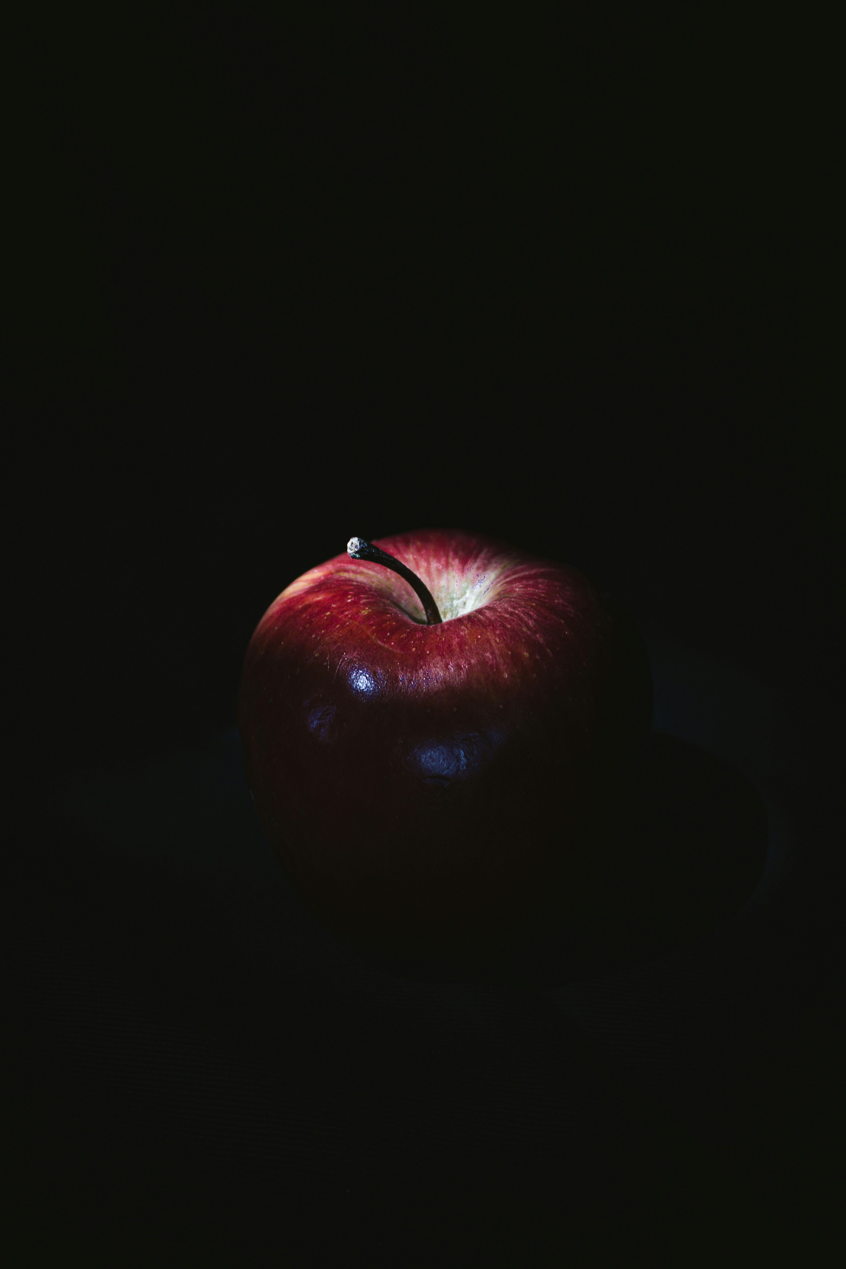 Rich apple  | red apple on black surface