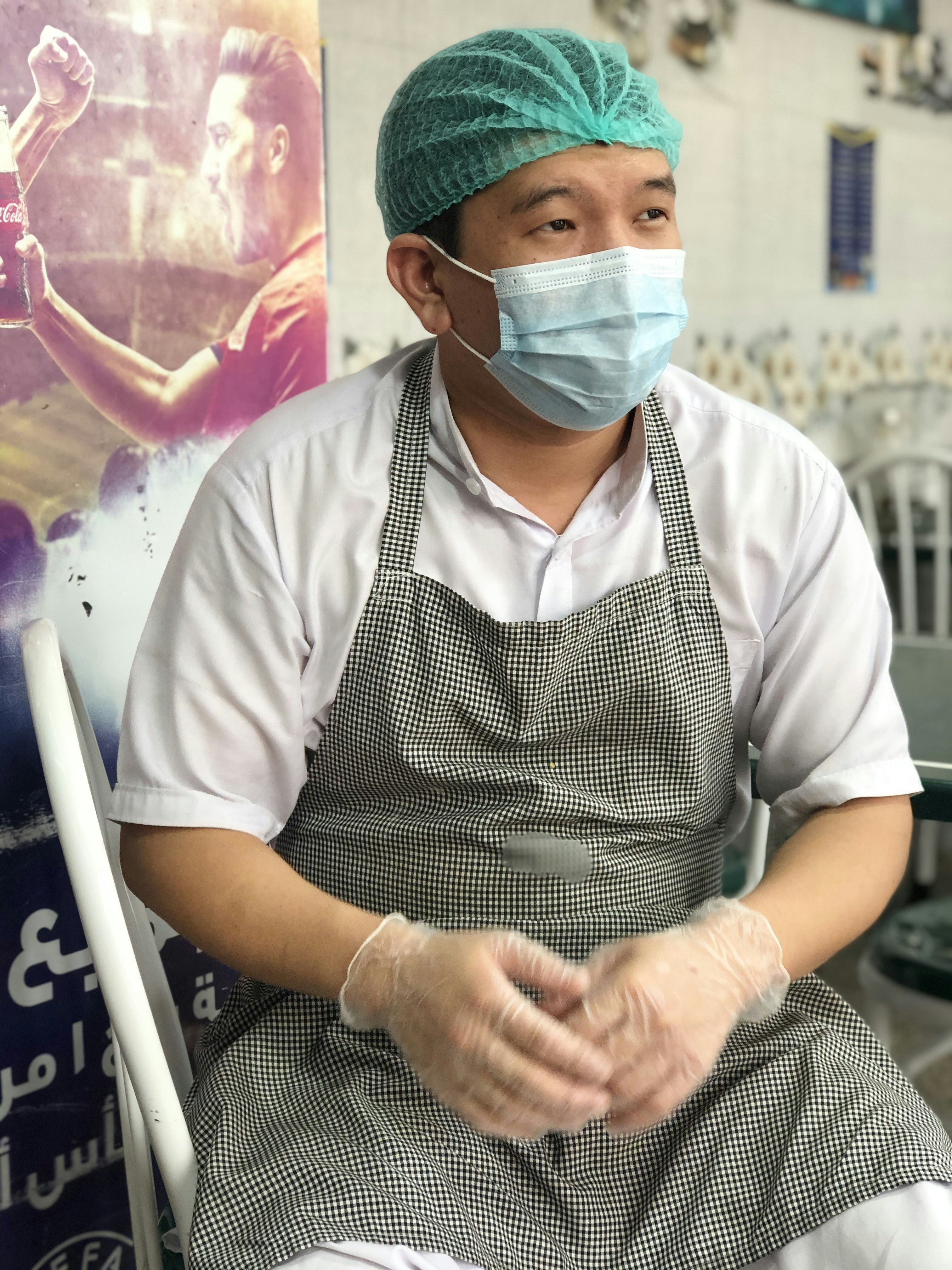 PPE Pause: A Market Cook in Apron and Mask