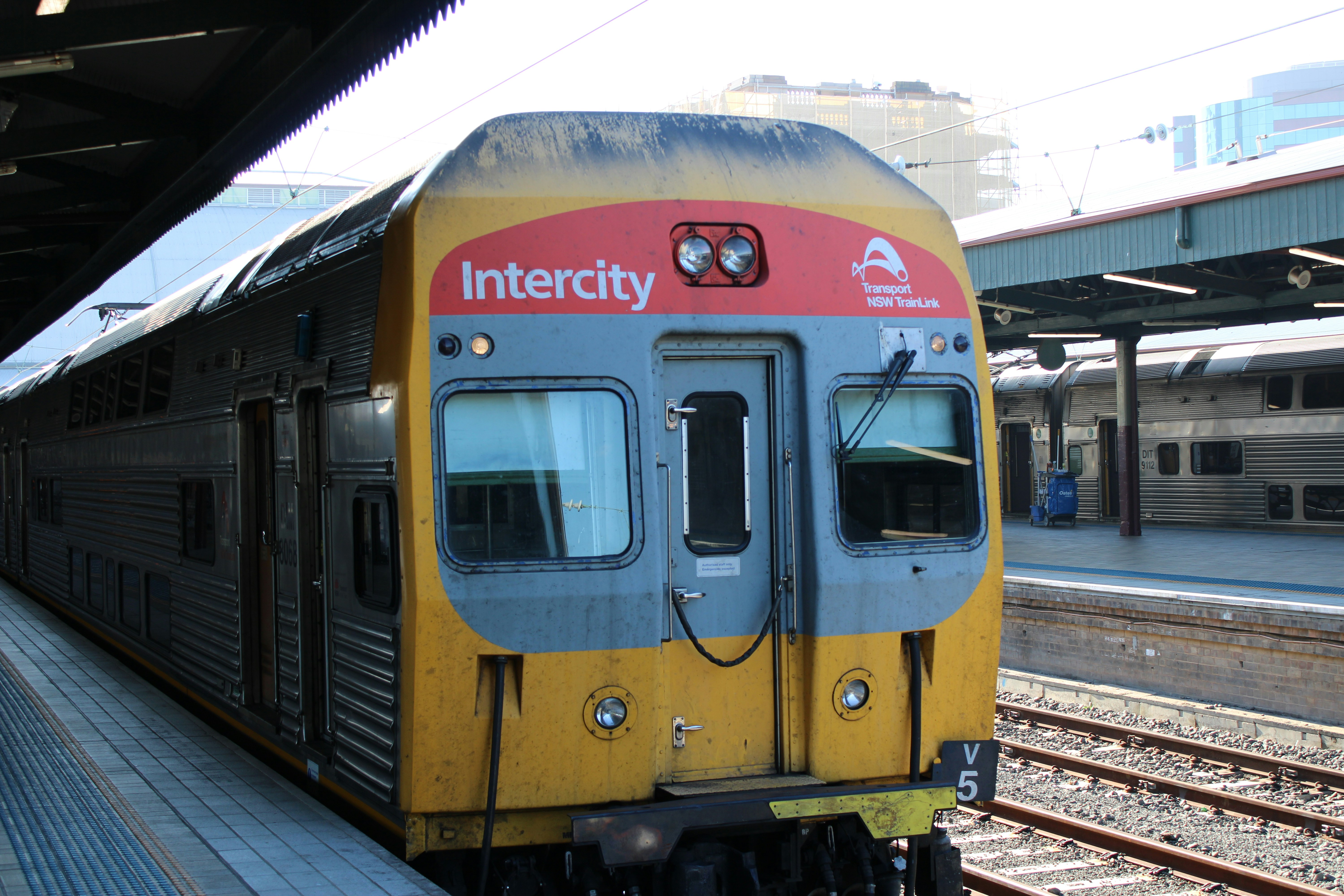 Front-Windowed Intercity Nose: Weathered diesel at a sunlit platform