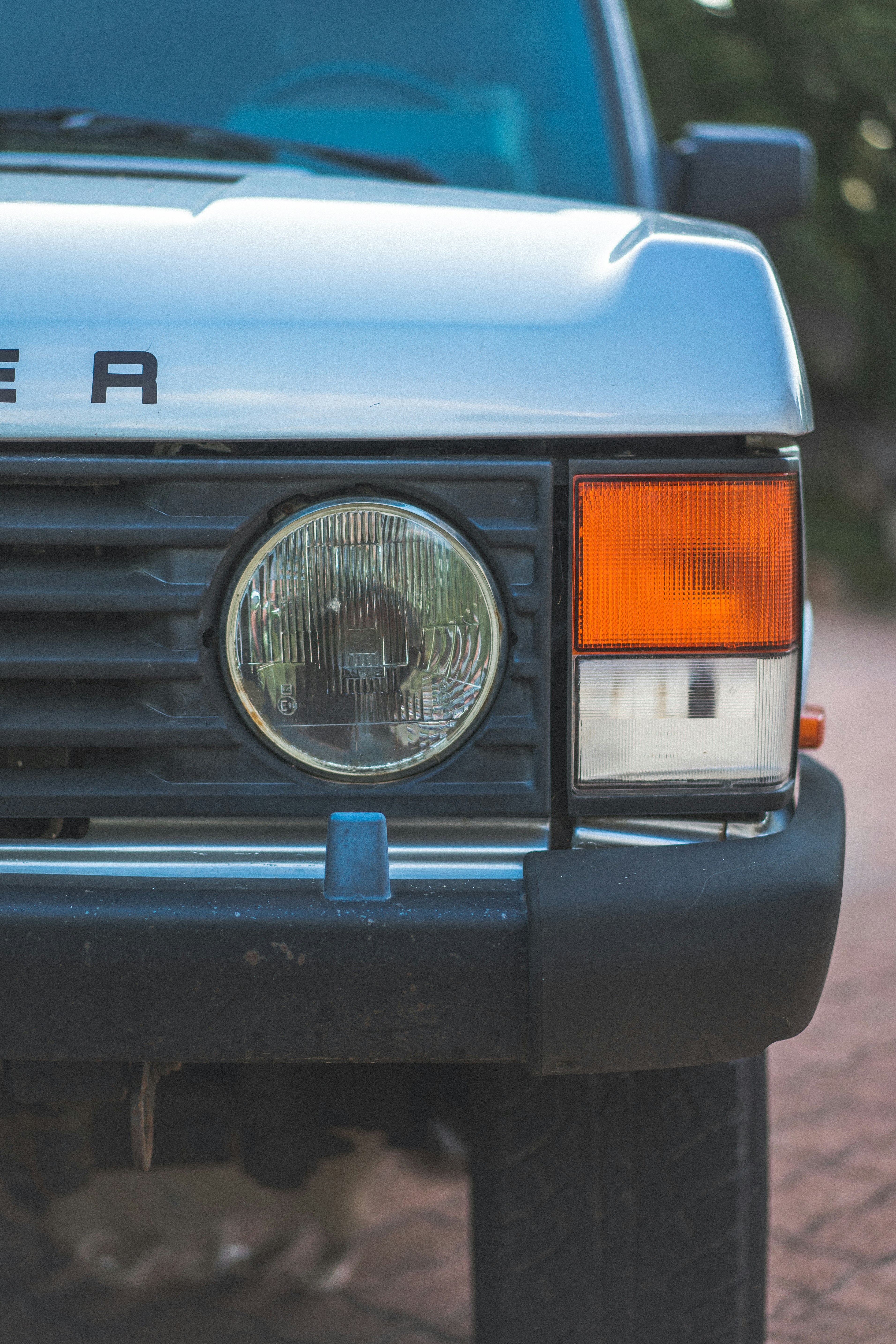 Front-End Sentinel: Round Headlamp of a Vintage Off-Roader