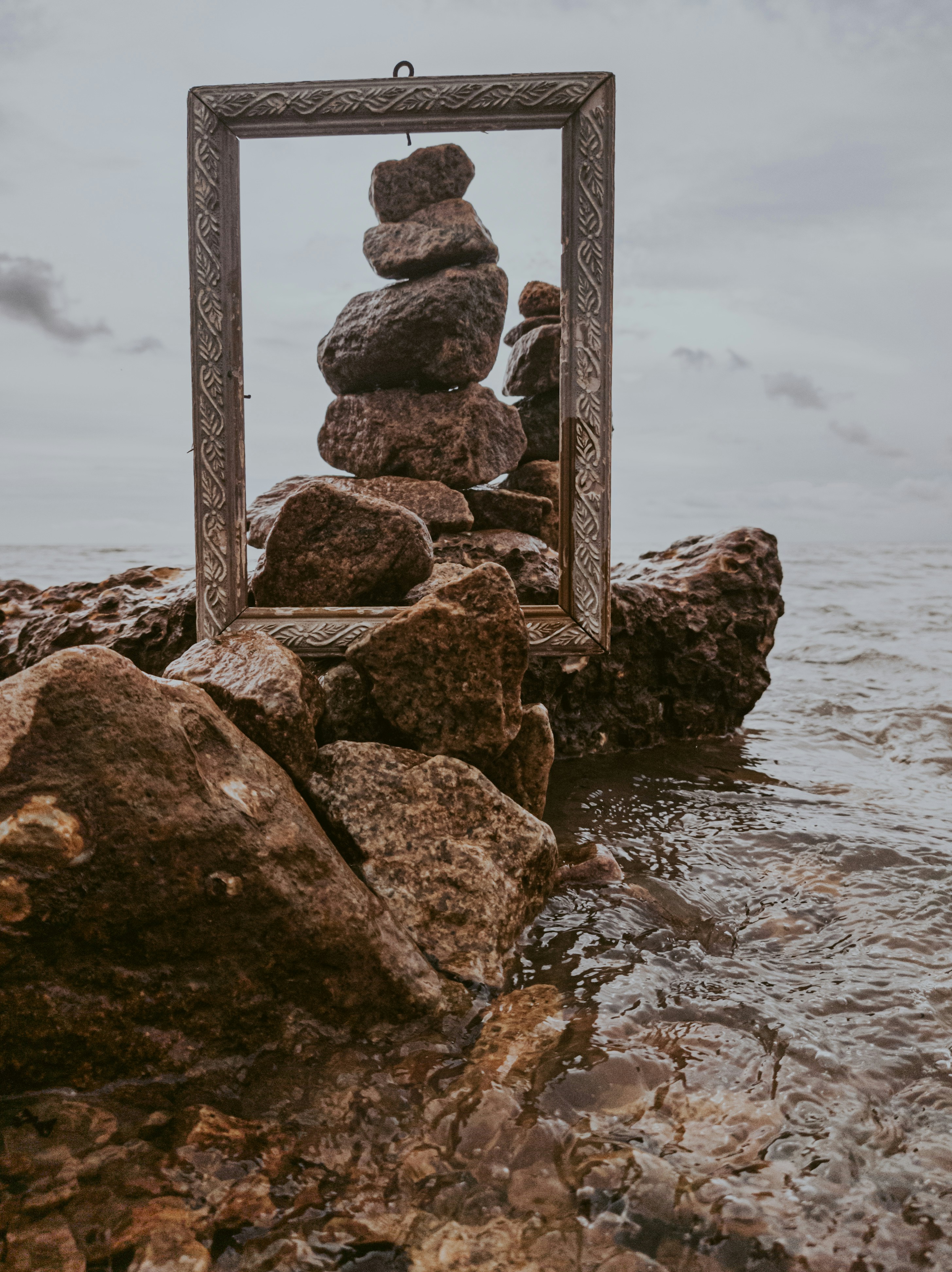 Framed Stones: a Quiet Stack Mirrors the Shore