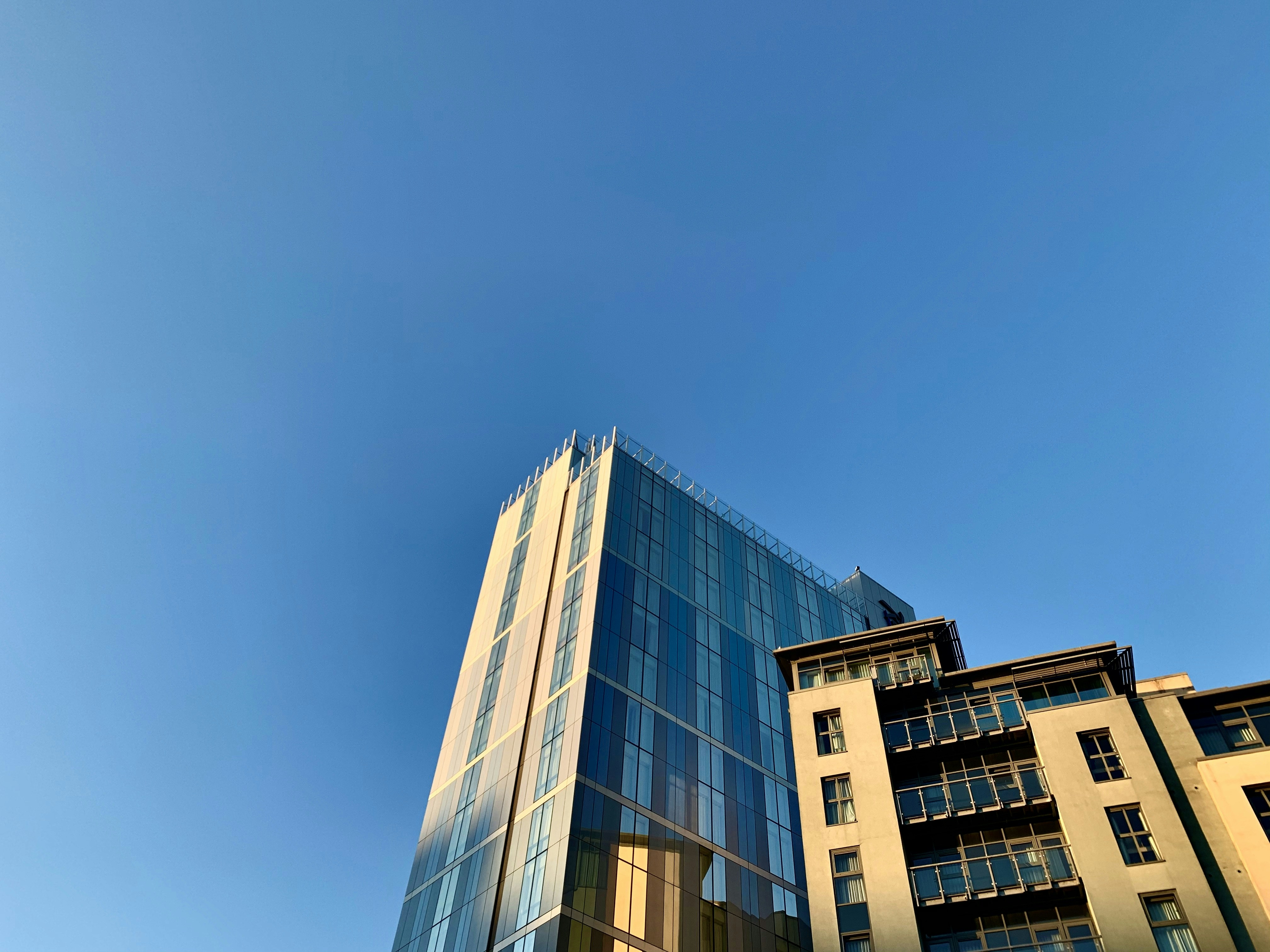 White and blue concrete building under blue sky during daytime photo ...