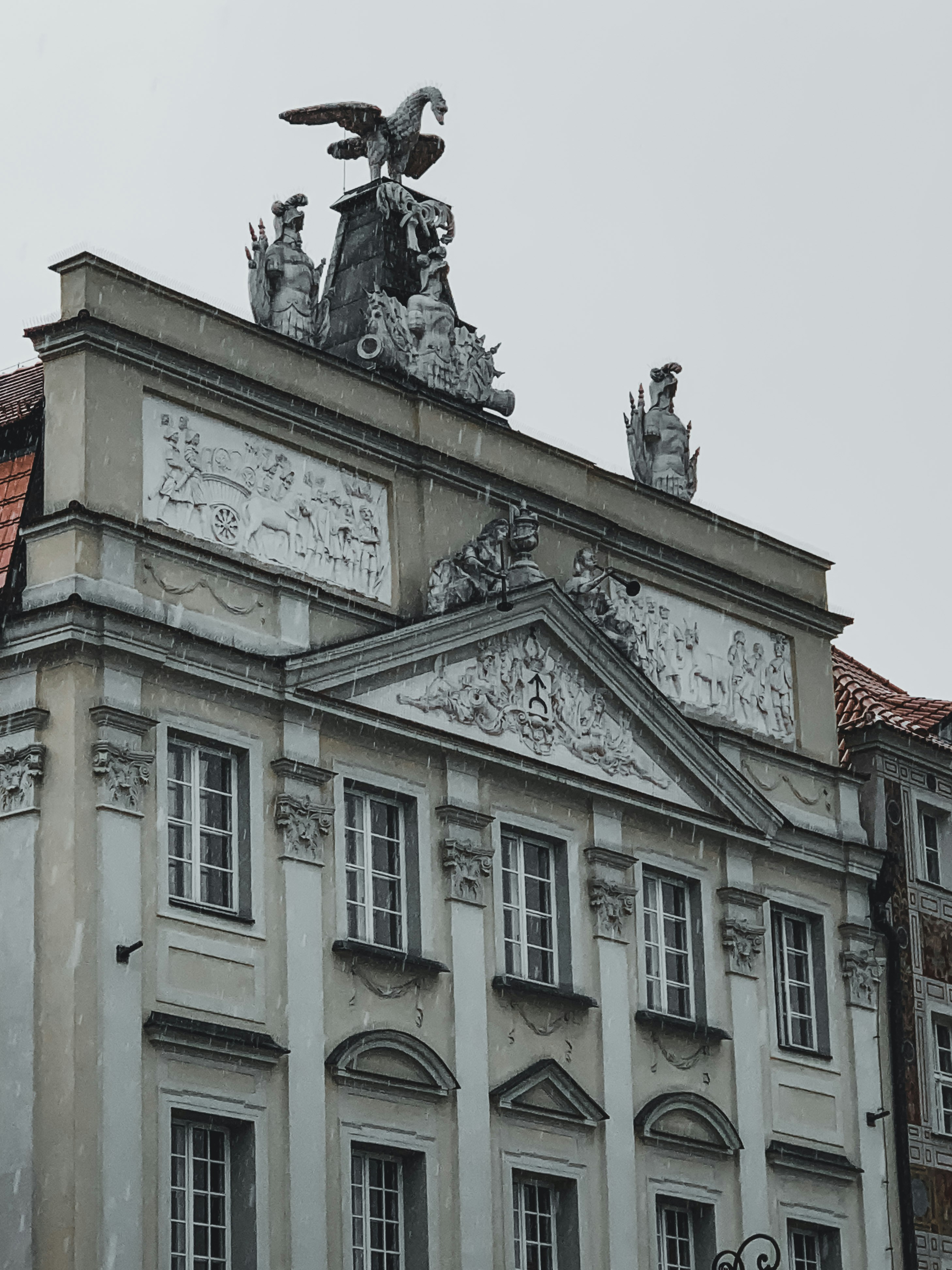 Eagle-Crowned Beaux-Arts Facade: Stone Guardians Under Winter Light
