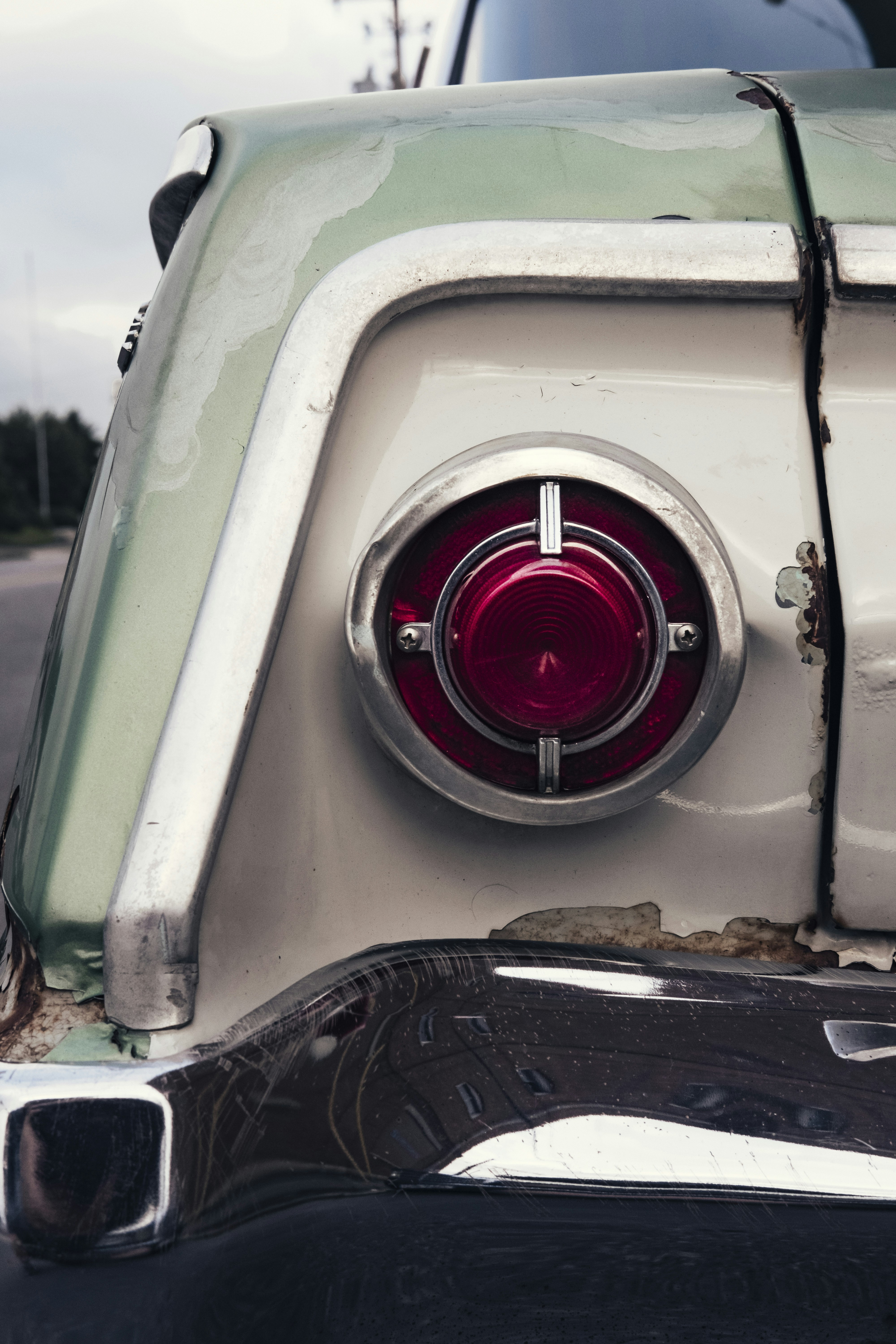 Crimson Circle in Chrome: Close-Up of a Vintage Tail Light