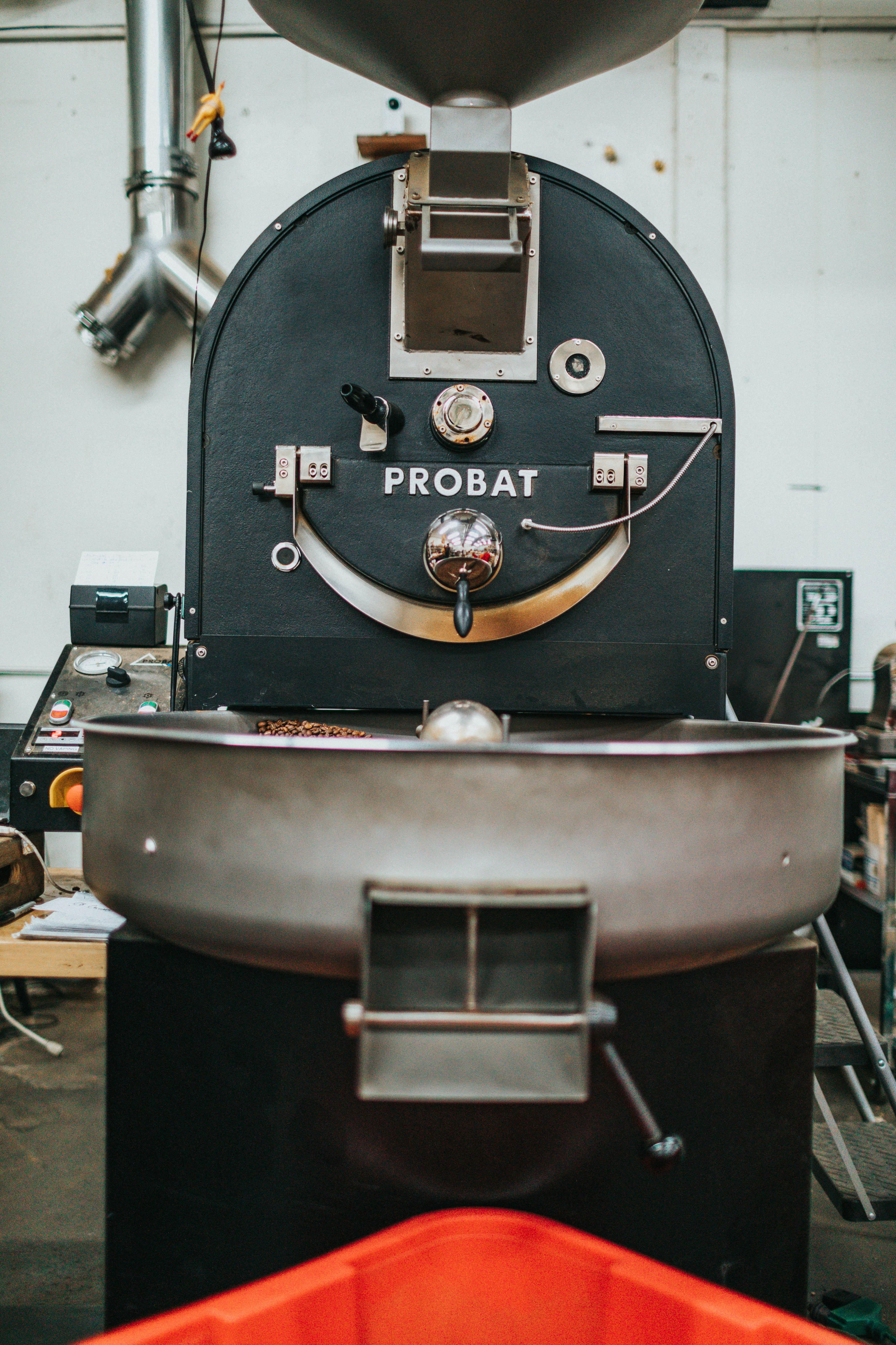 Industrial roaster in a workshop: the Probat machine under warm factory light