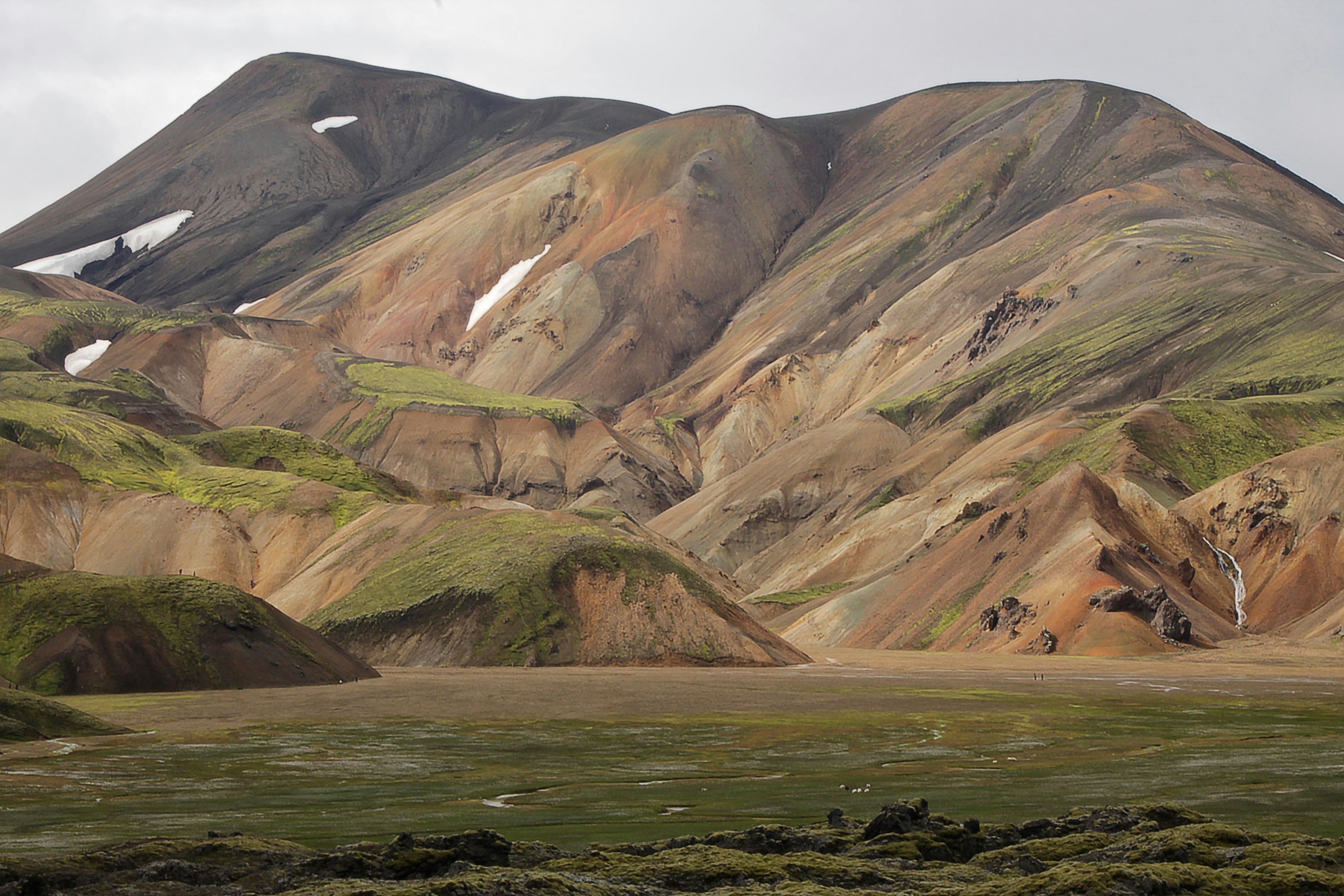Green and brown mountains under white sky during daytime photo – Free ...