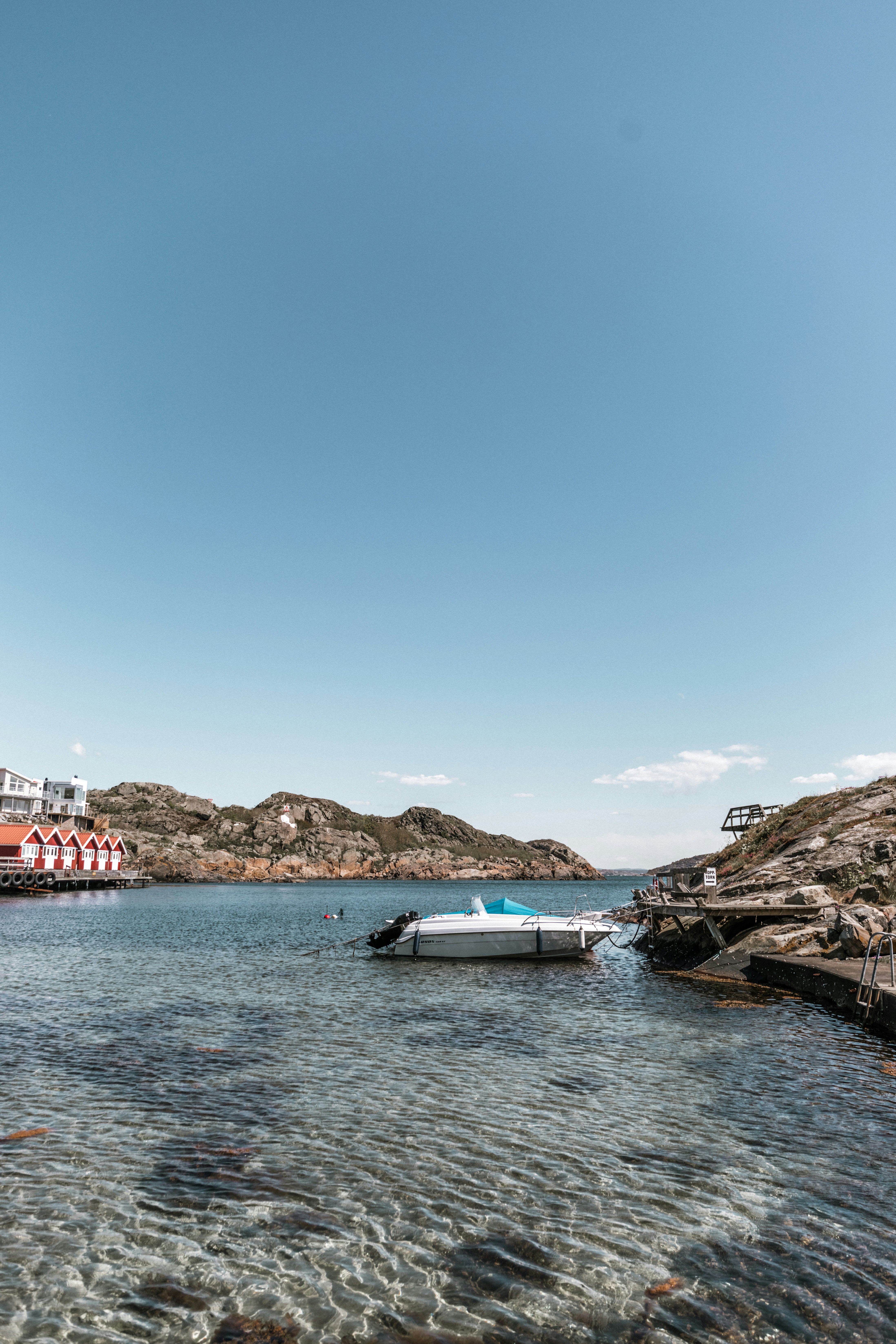 Coastal Boats at Dusk: Clear Sky over a Quiet Harbor