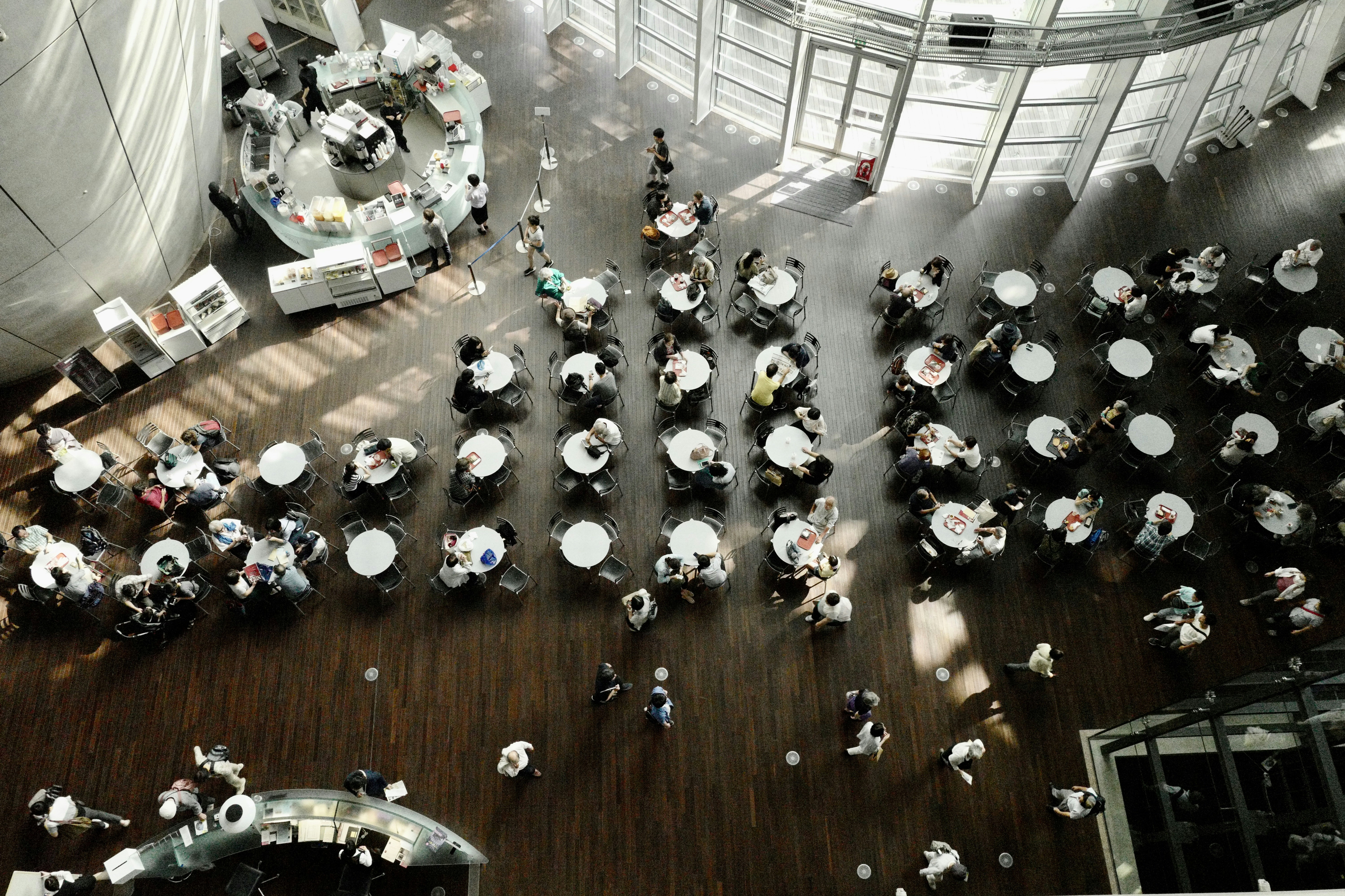 A Bird’s-Eye Café: Circular Tables and Busy Circulation in a Modern Atrium