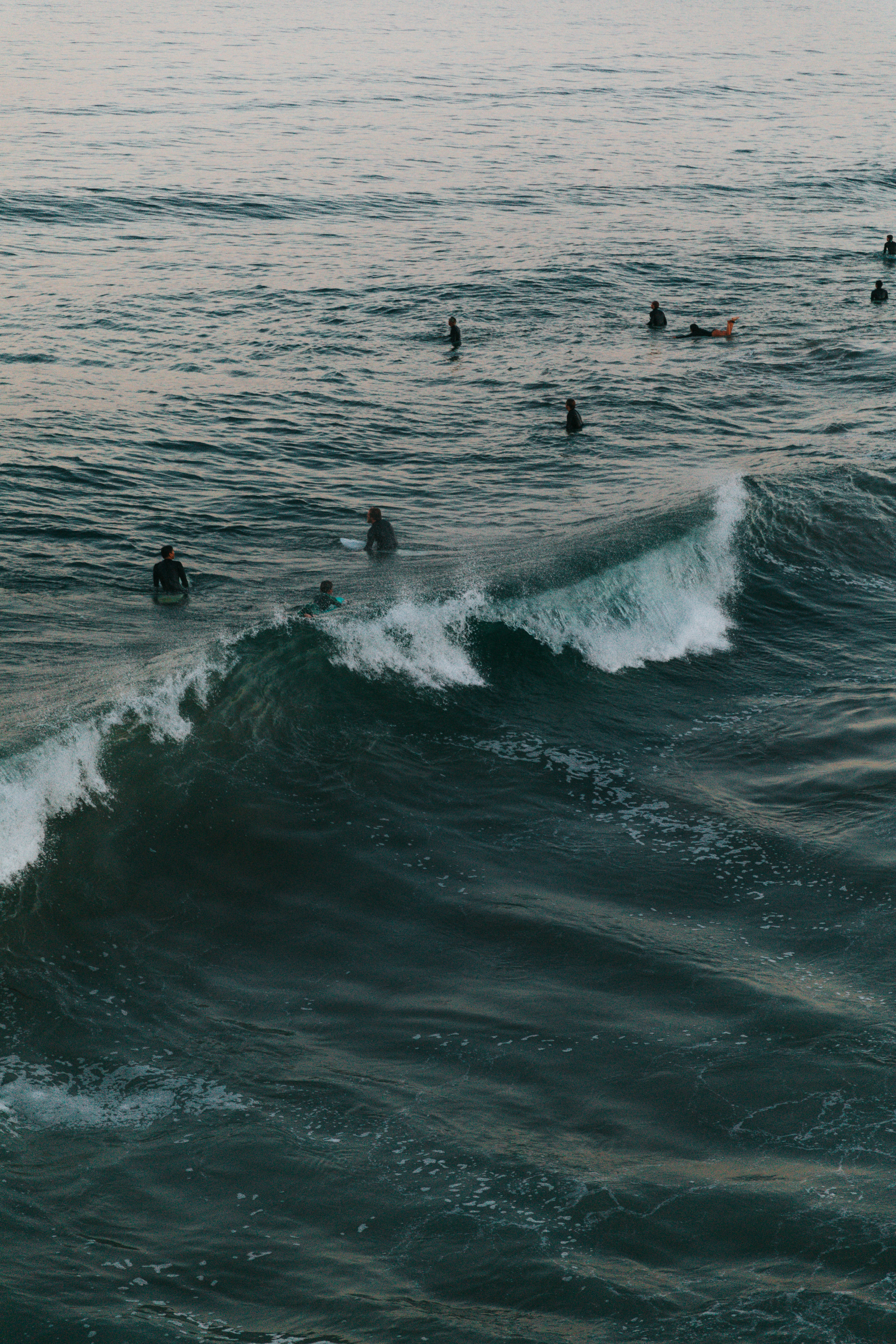 Curl Line Convergence: Surfers on a Moving Ocean Wall