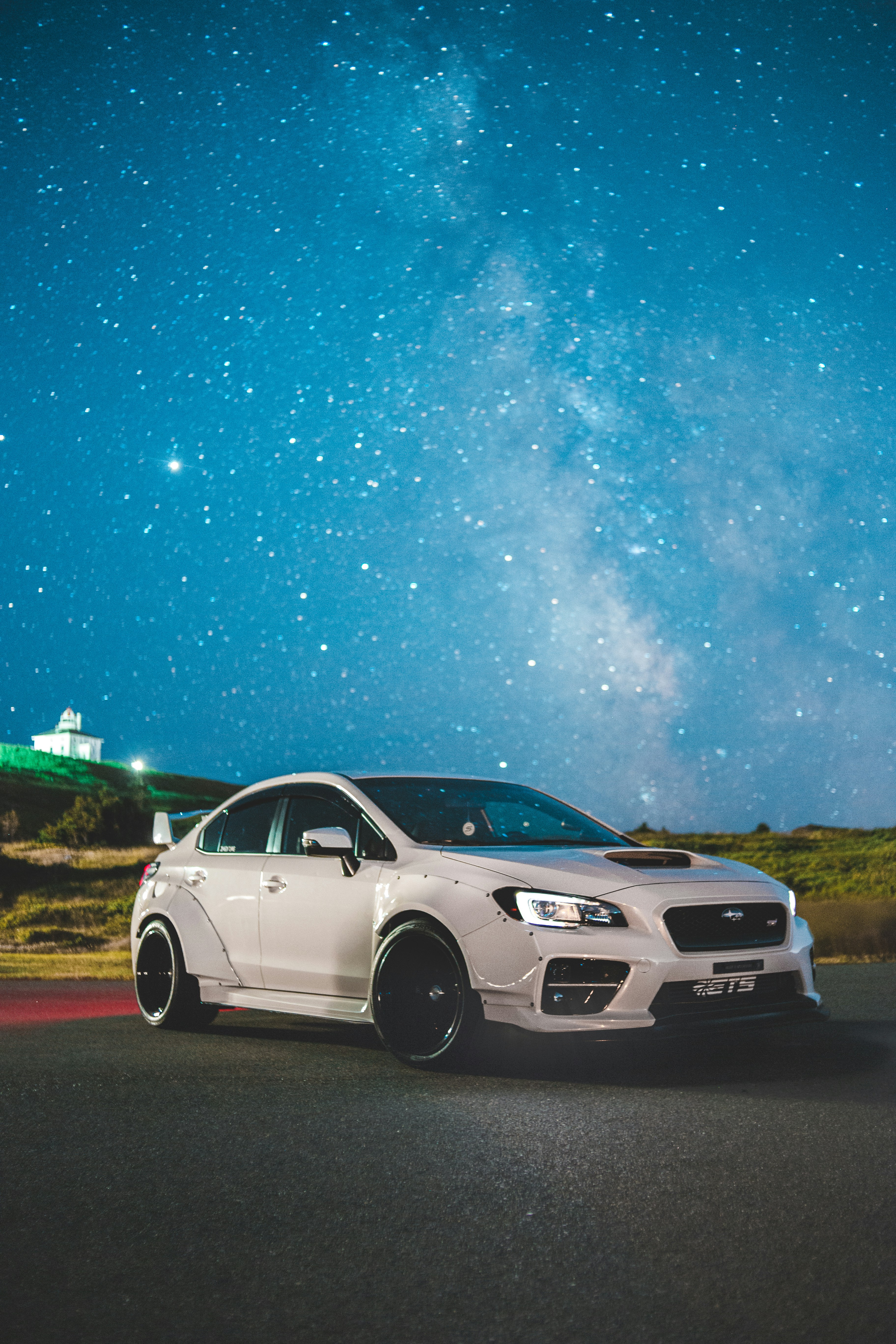 Milky Way Over a White Subaru WRX STI on a Quiet Night Road