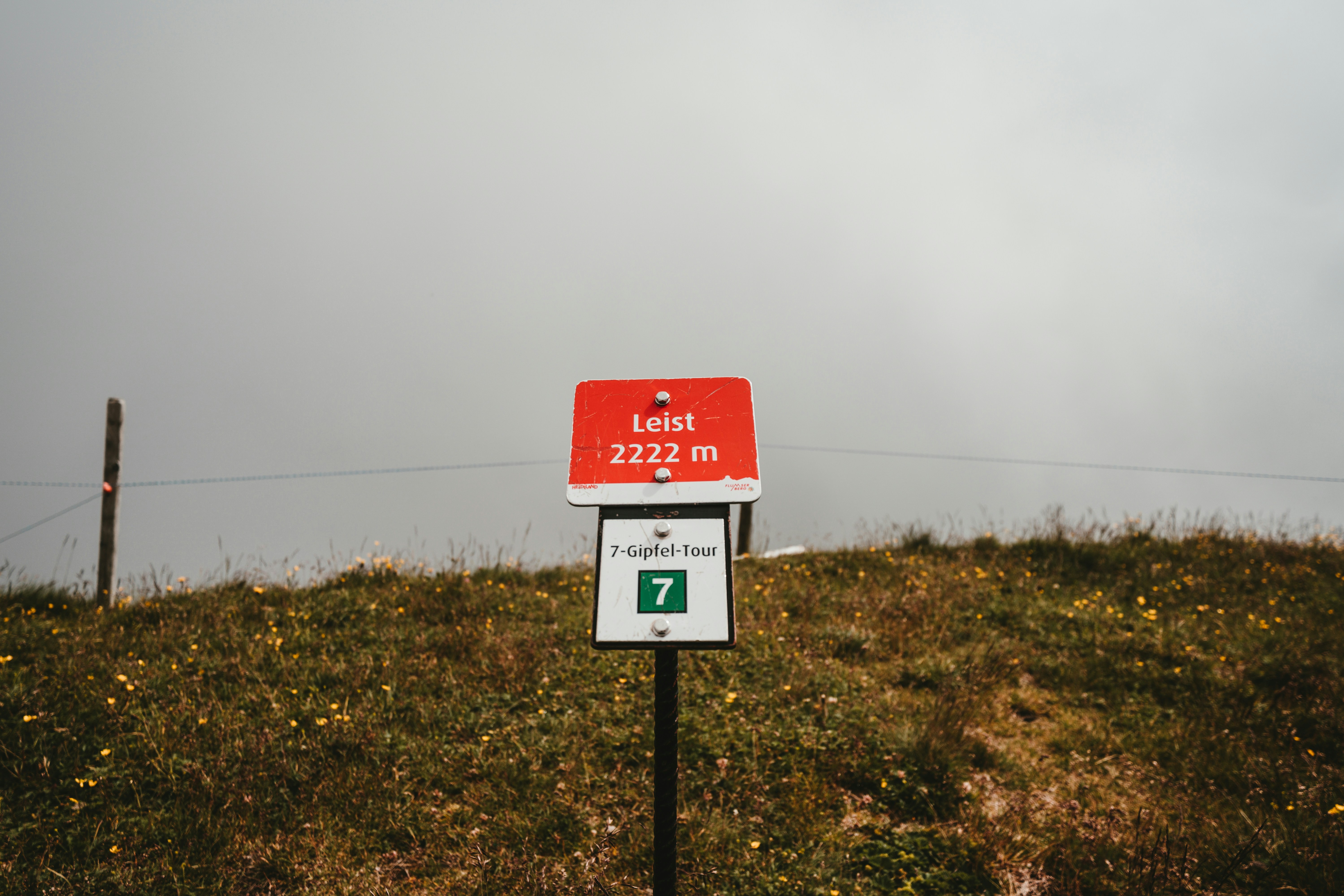 Red Sign on a Mountaintop Hinting at Elevation