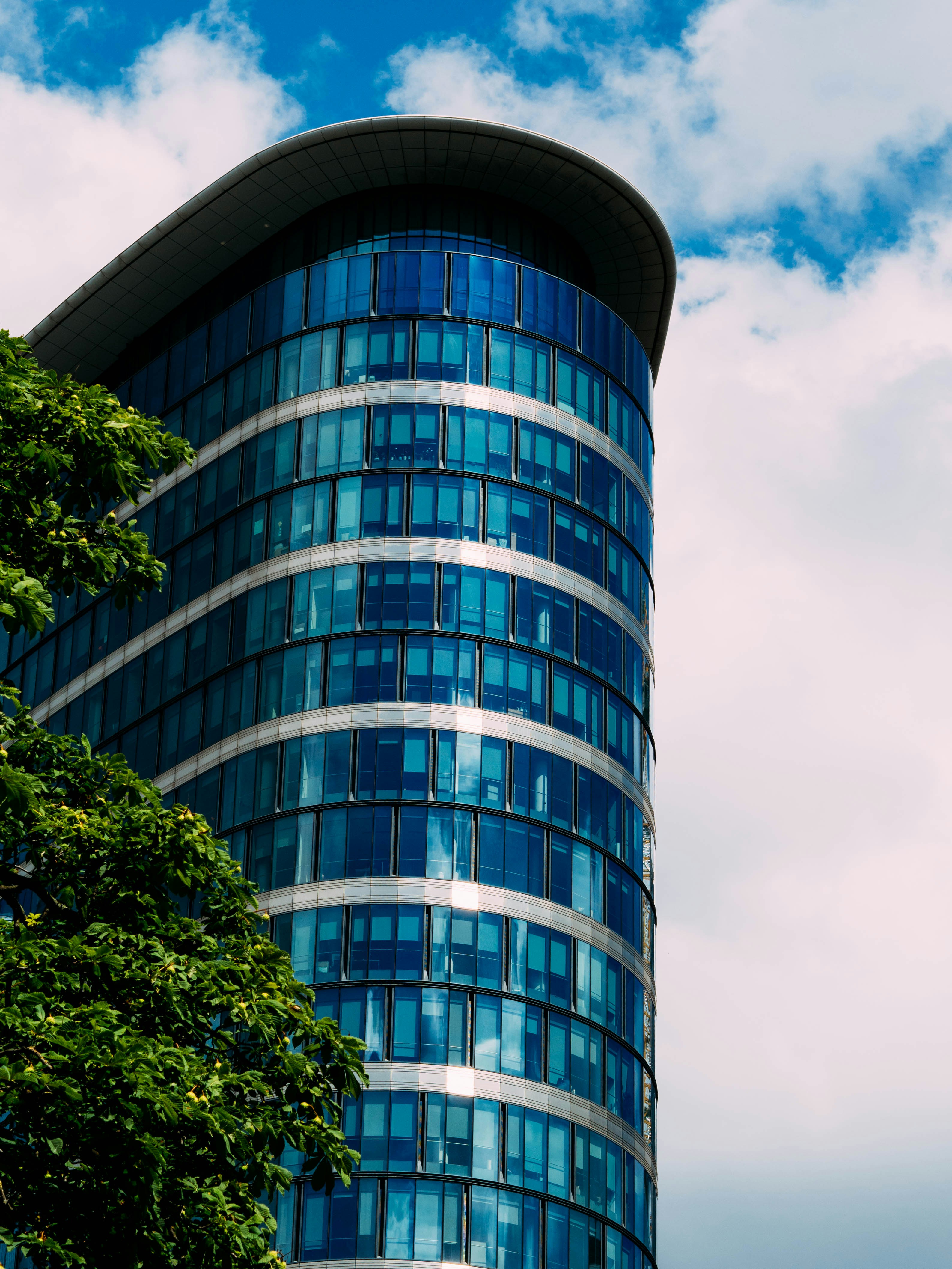 Blue glass walled high rise building photo – Free Building Image on ...