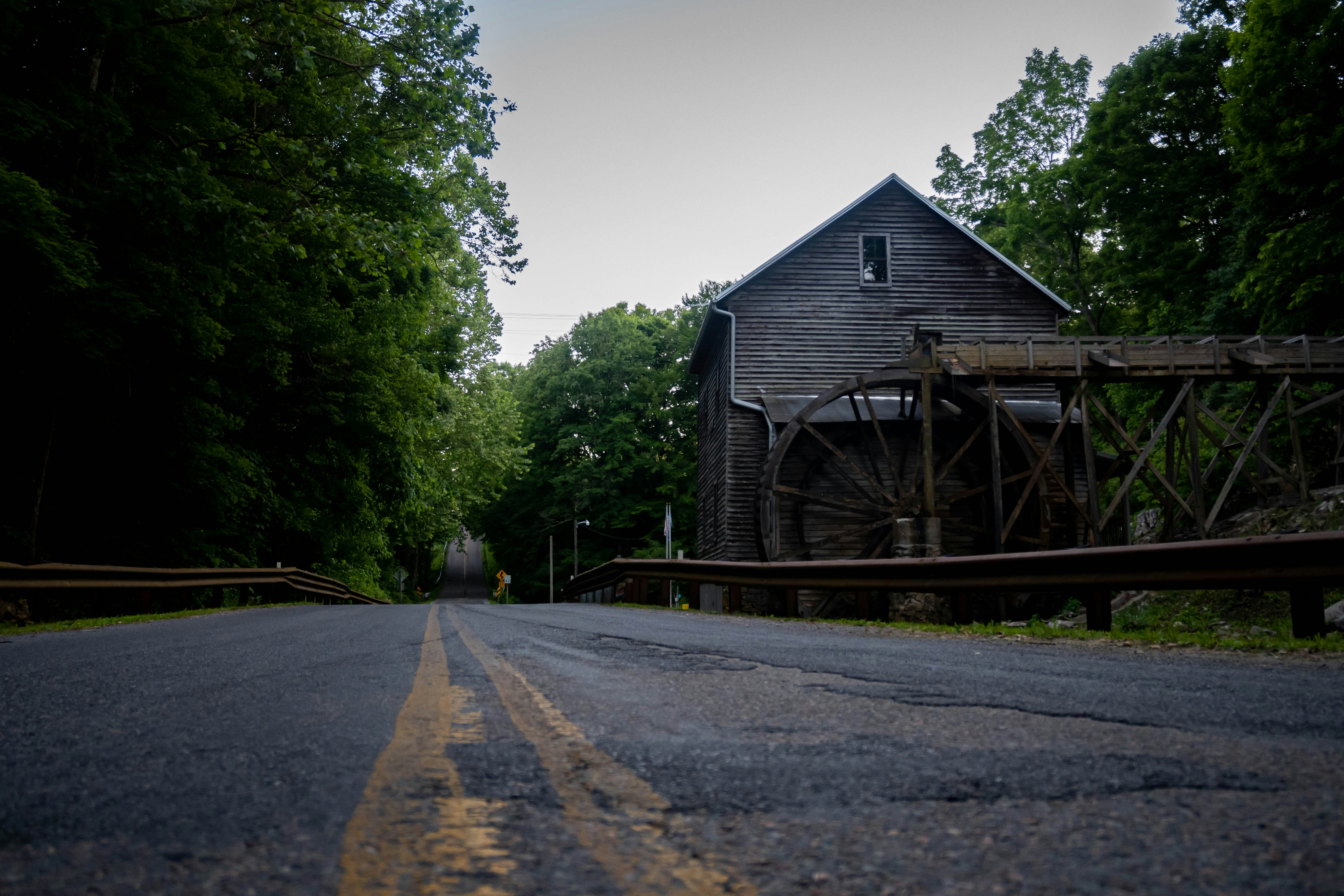 Old Mill Road: A Quiet Ascent Toward a Distant Gate