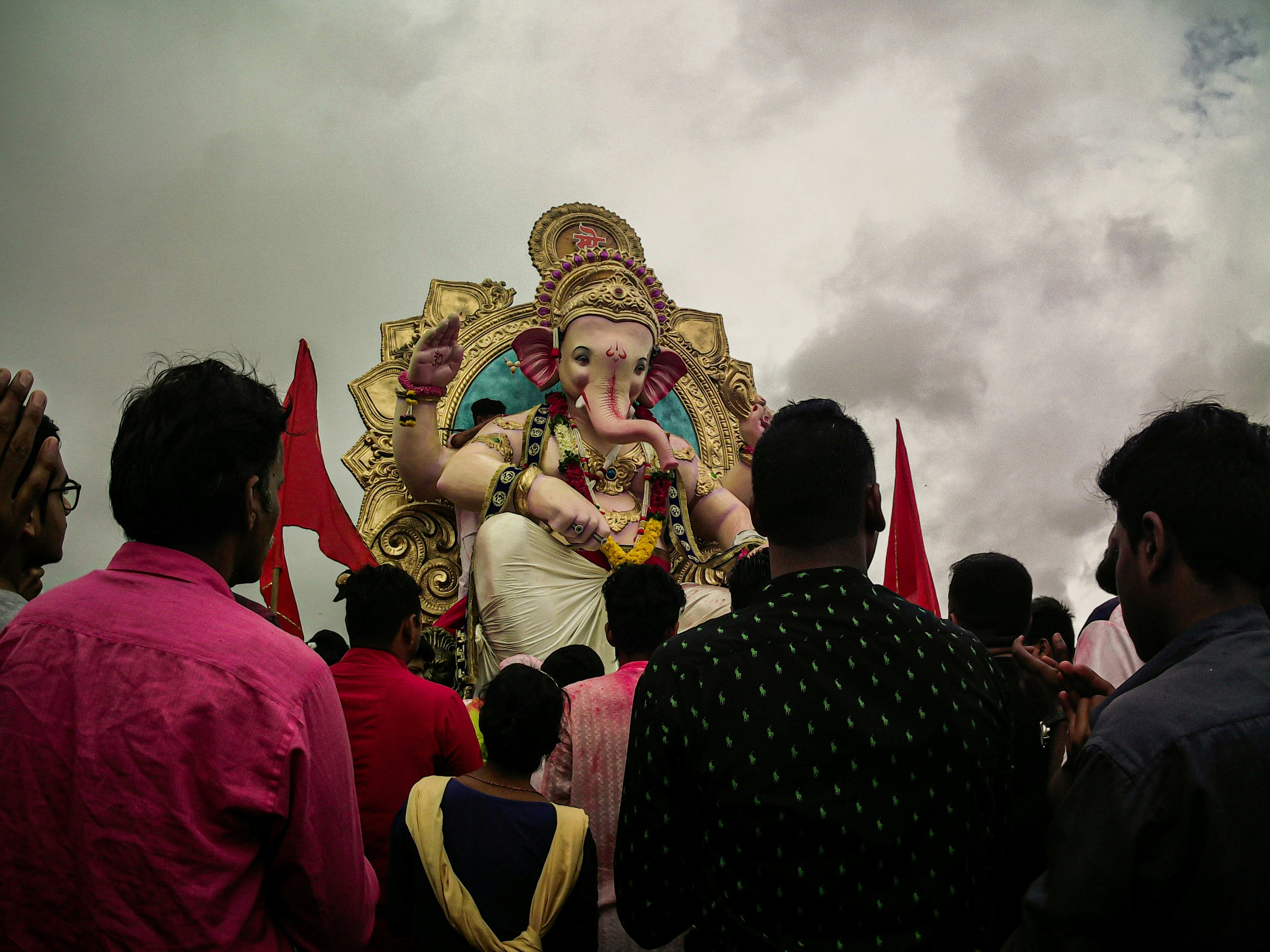people in red and gold traditional dress