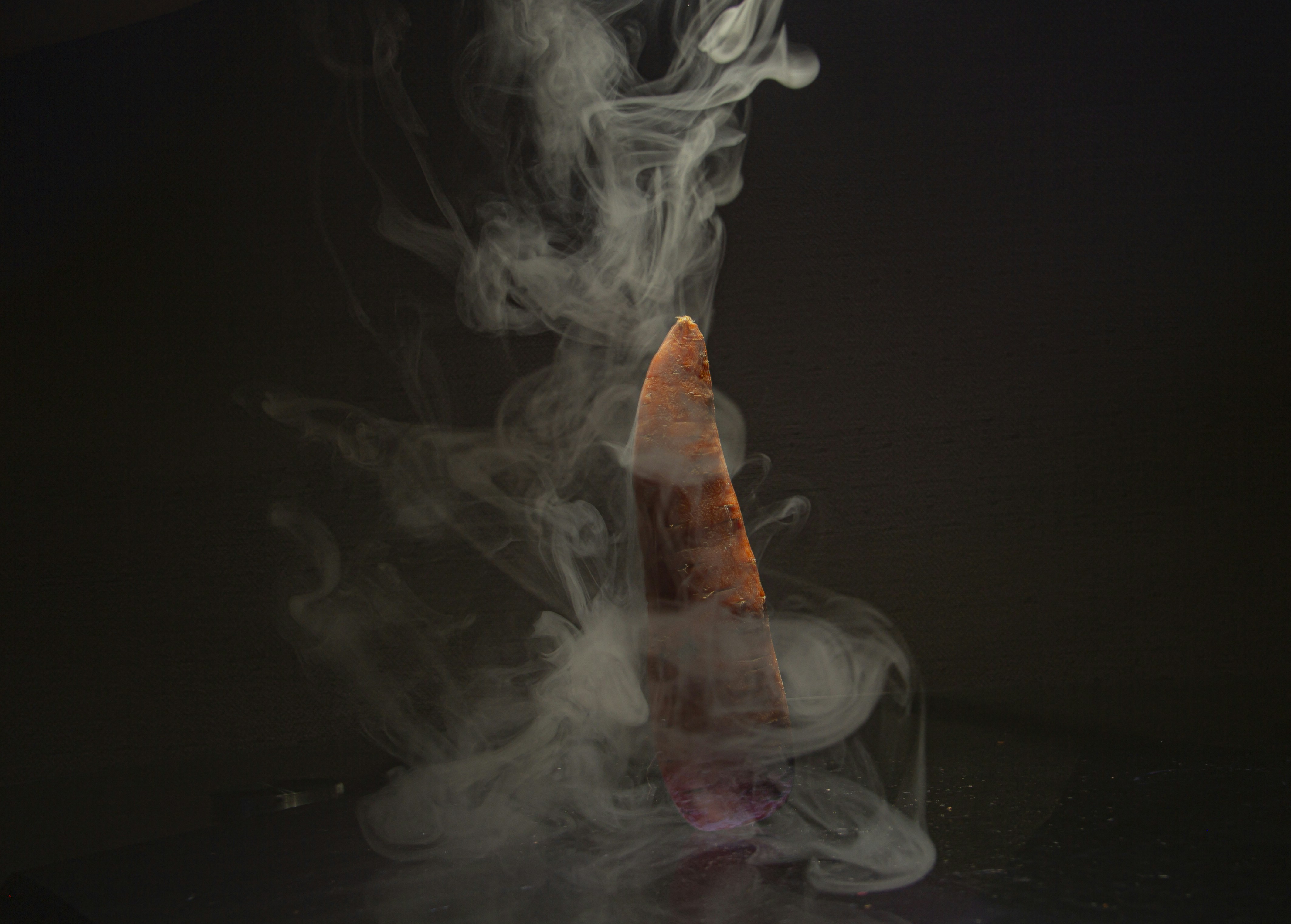 white smoke on clear glass bottle