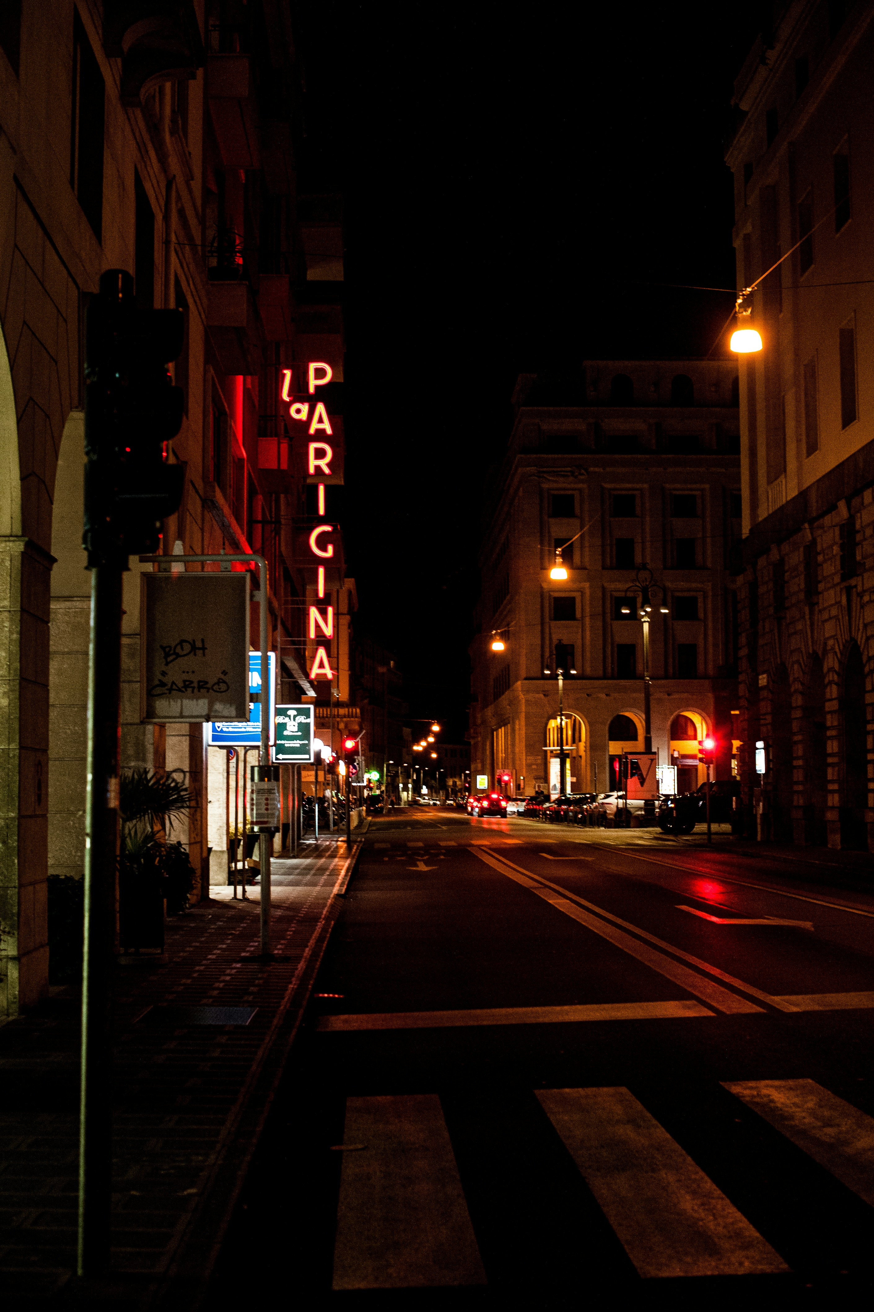 Night Street – Neon Signage and Wet Crosswalk Lead the Quiet Horizon