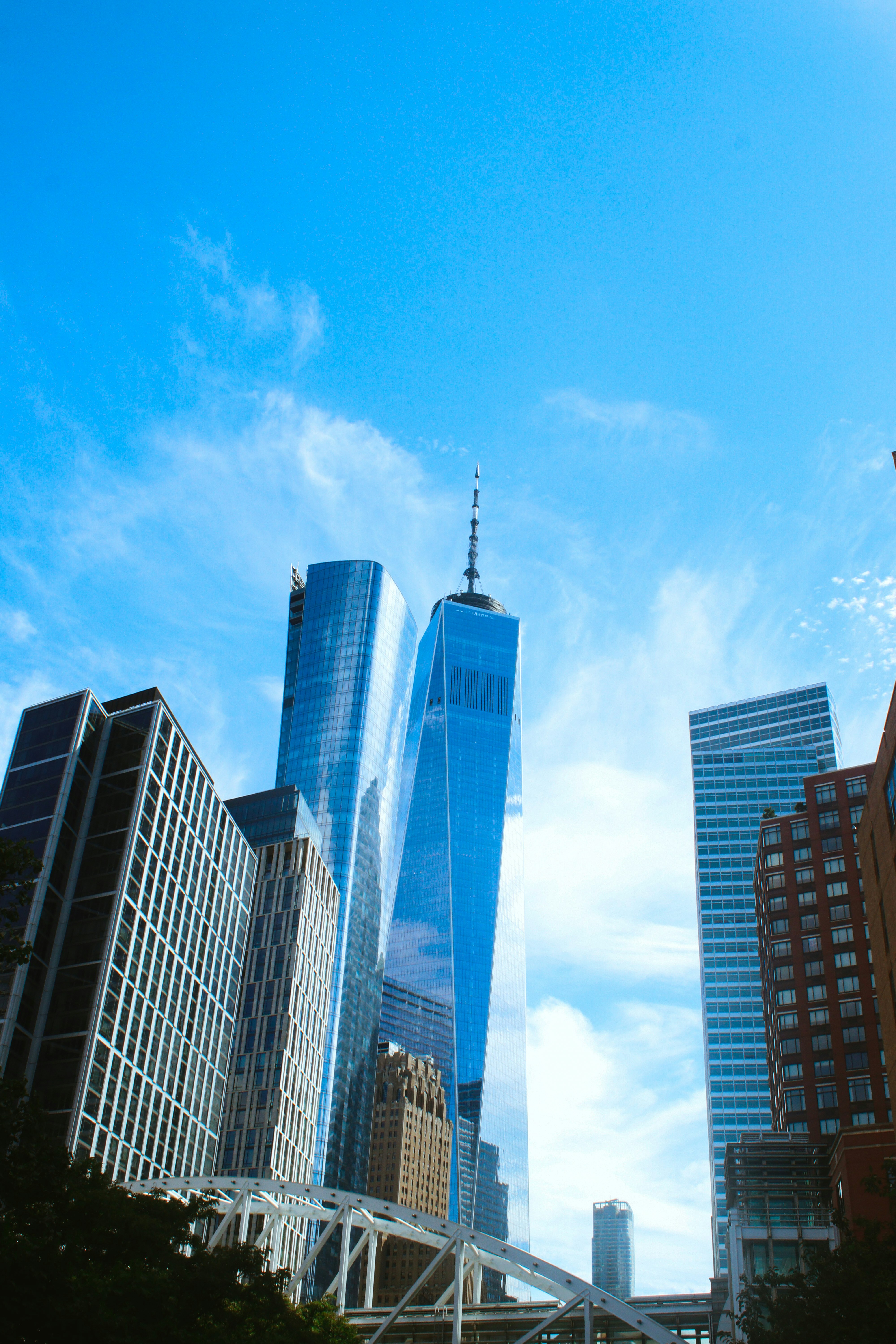 Blue and white high rise buildings under blue sky during daytime photo ...