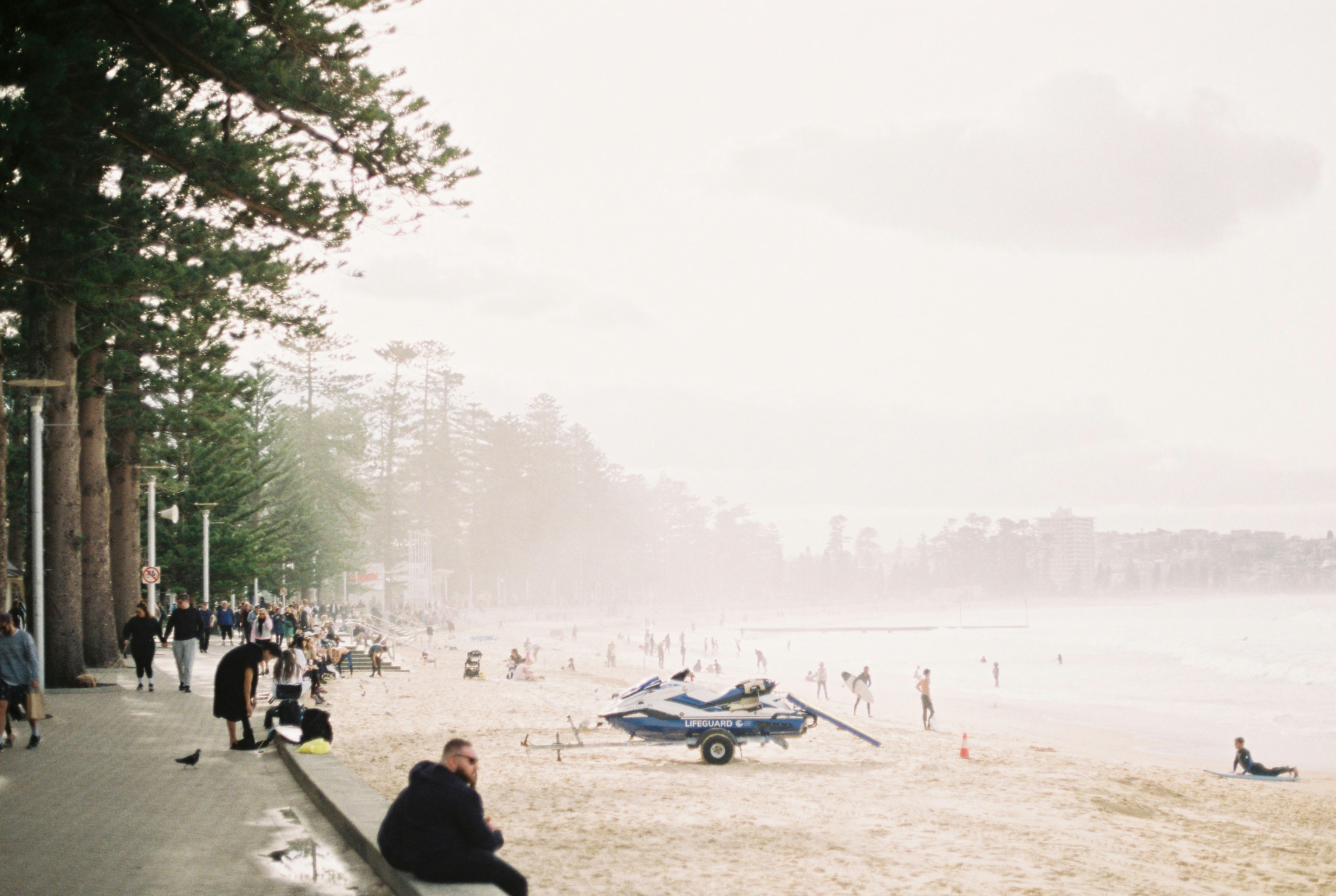 Jet Ski at Rest on a Hazy City Beach Promenade
