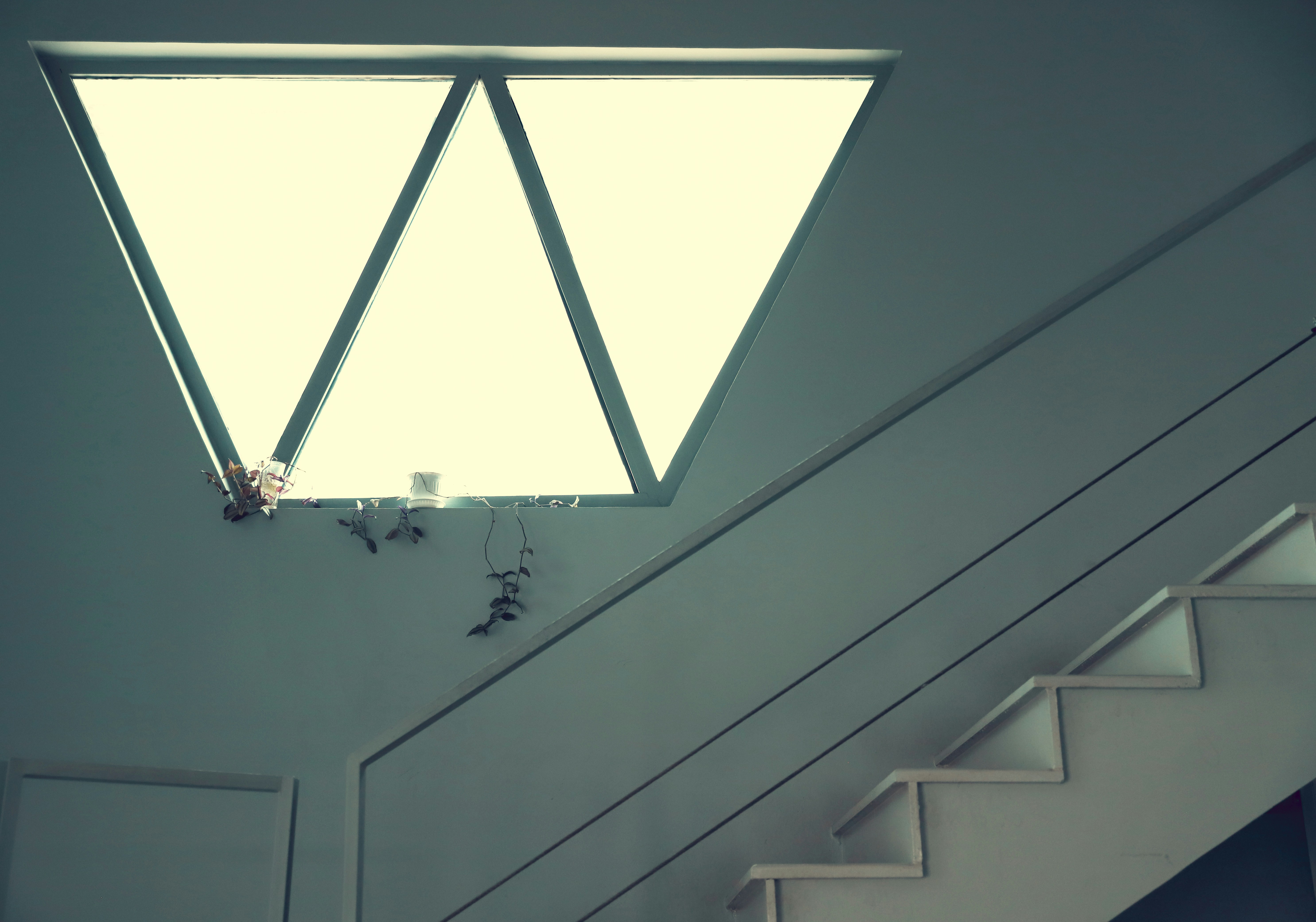 Triangular Skylight and Quiet Staircase: Geometry in a Modern Interior