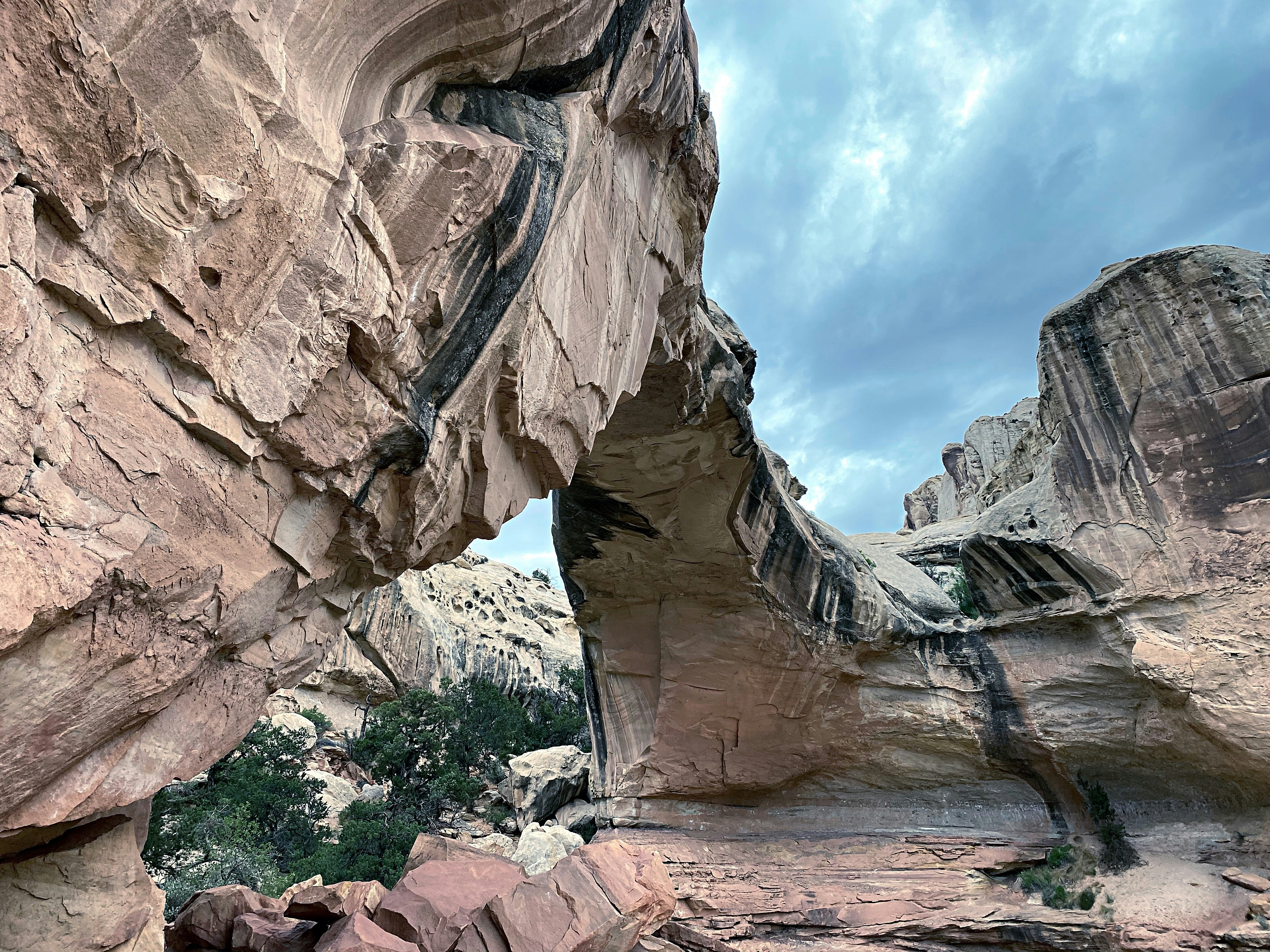 Natural Archway Echoes: Stone Curves and Blue Sky