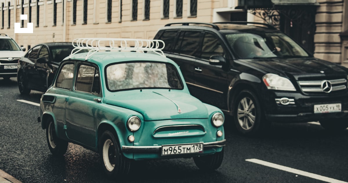Green Volkswagen Beetle Parked On The Side Of The Road Photo Free