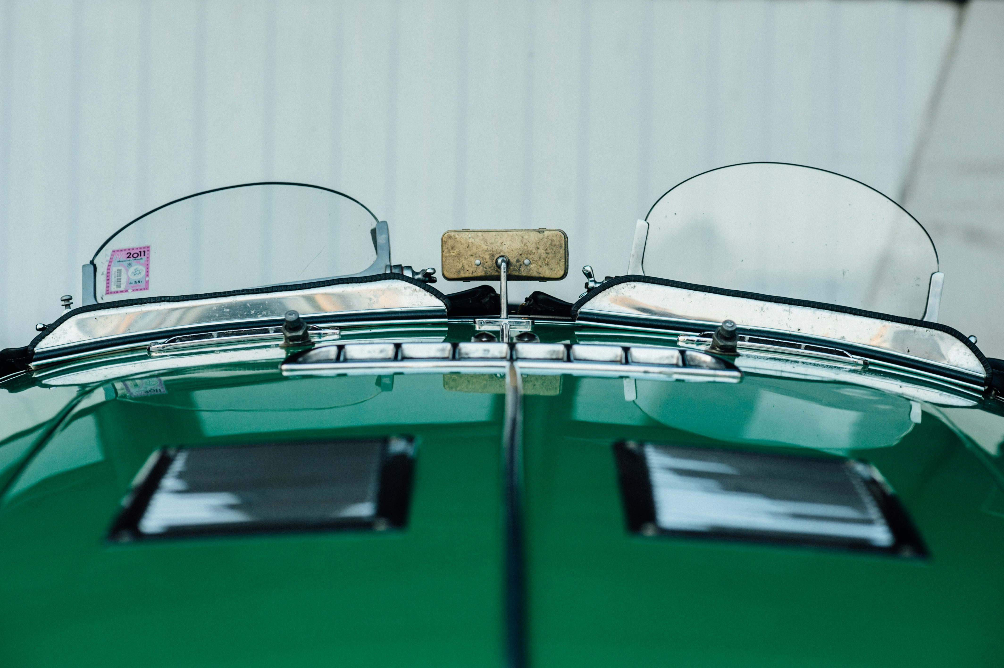 Emerald Front: Split-Windscreen Symmetry on a Vintage Green Roadster