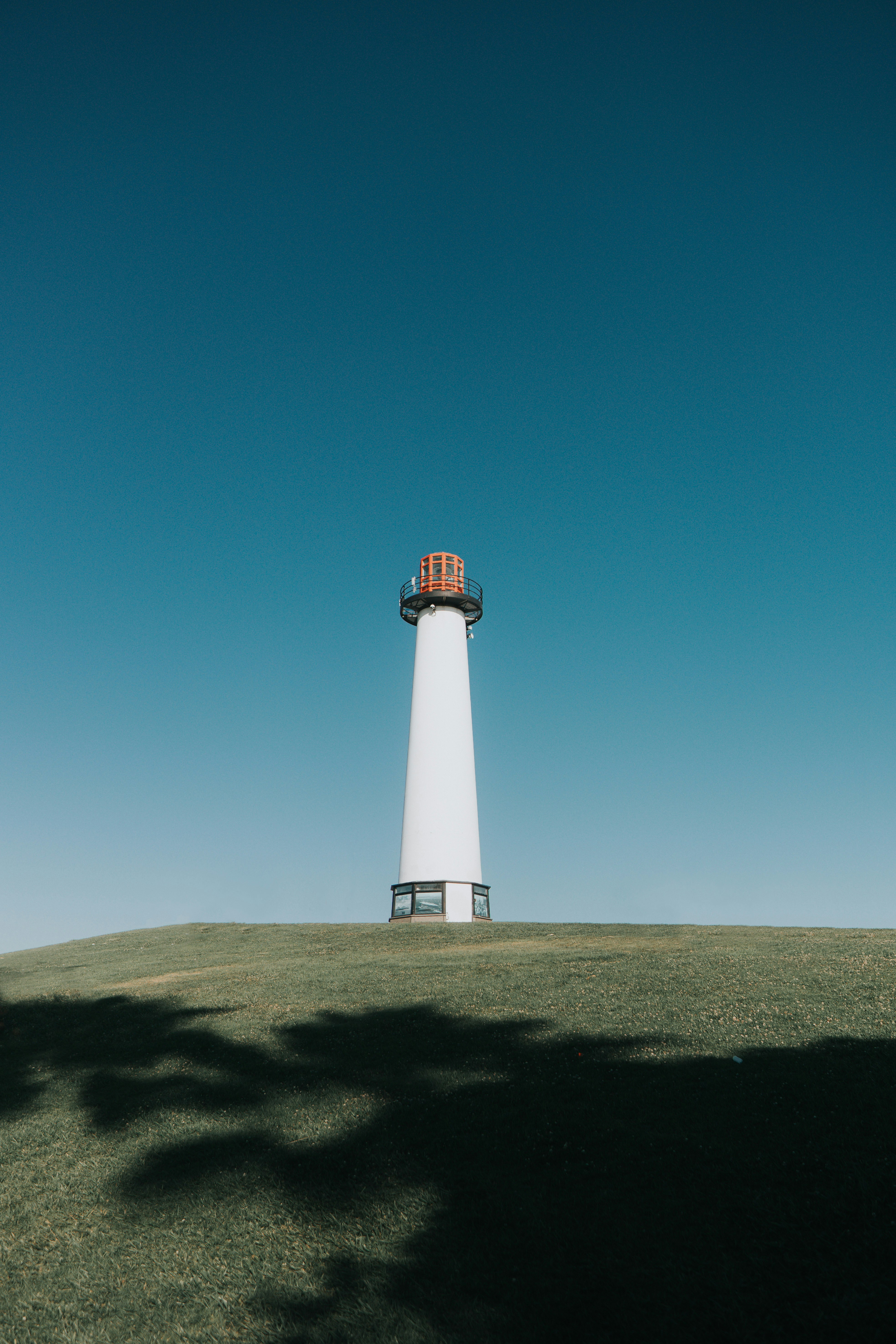 White and brown lighthouse under blue sky during daytime photo – Free ...