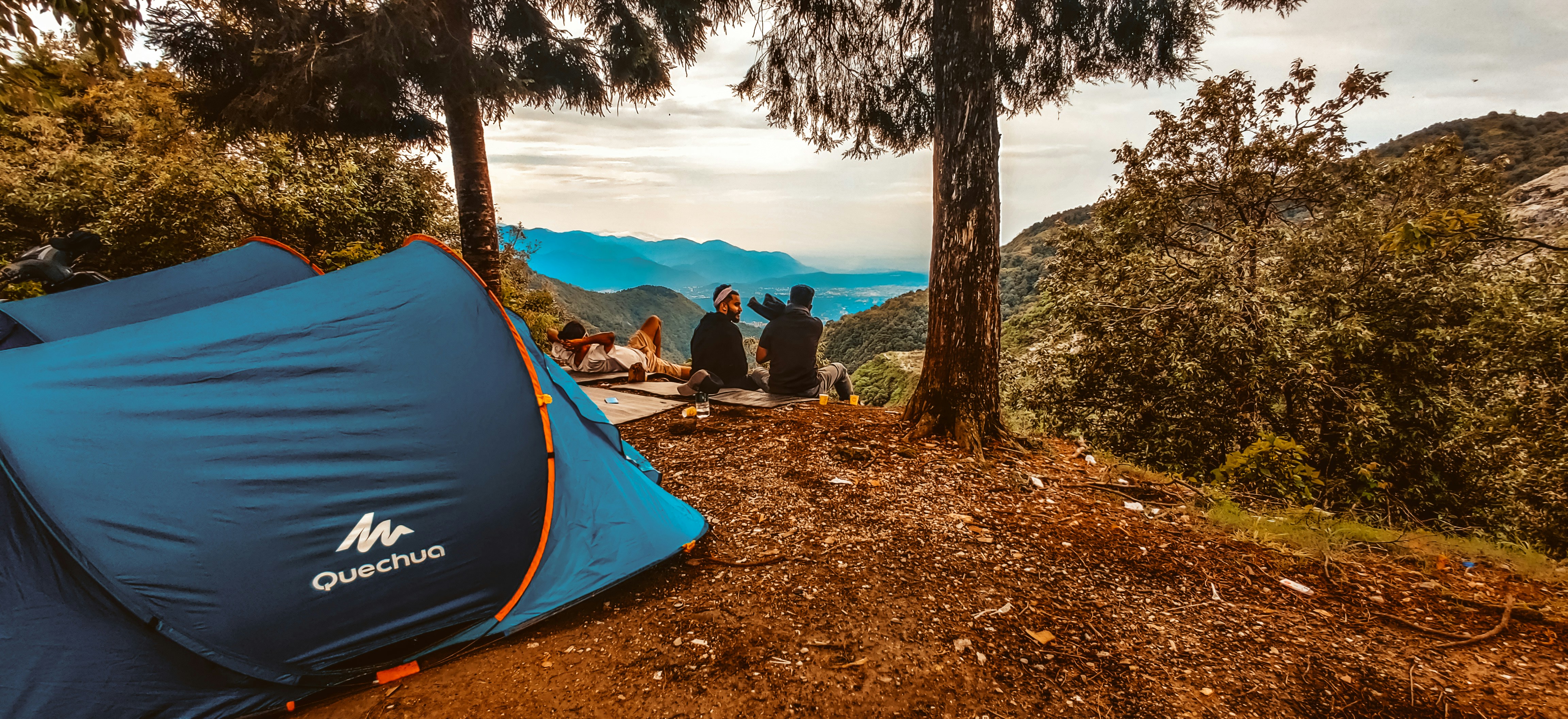 People sitting on camping chairs near green tent during daytime photo ...