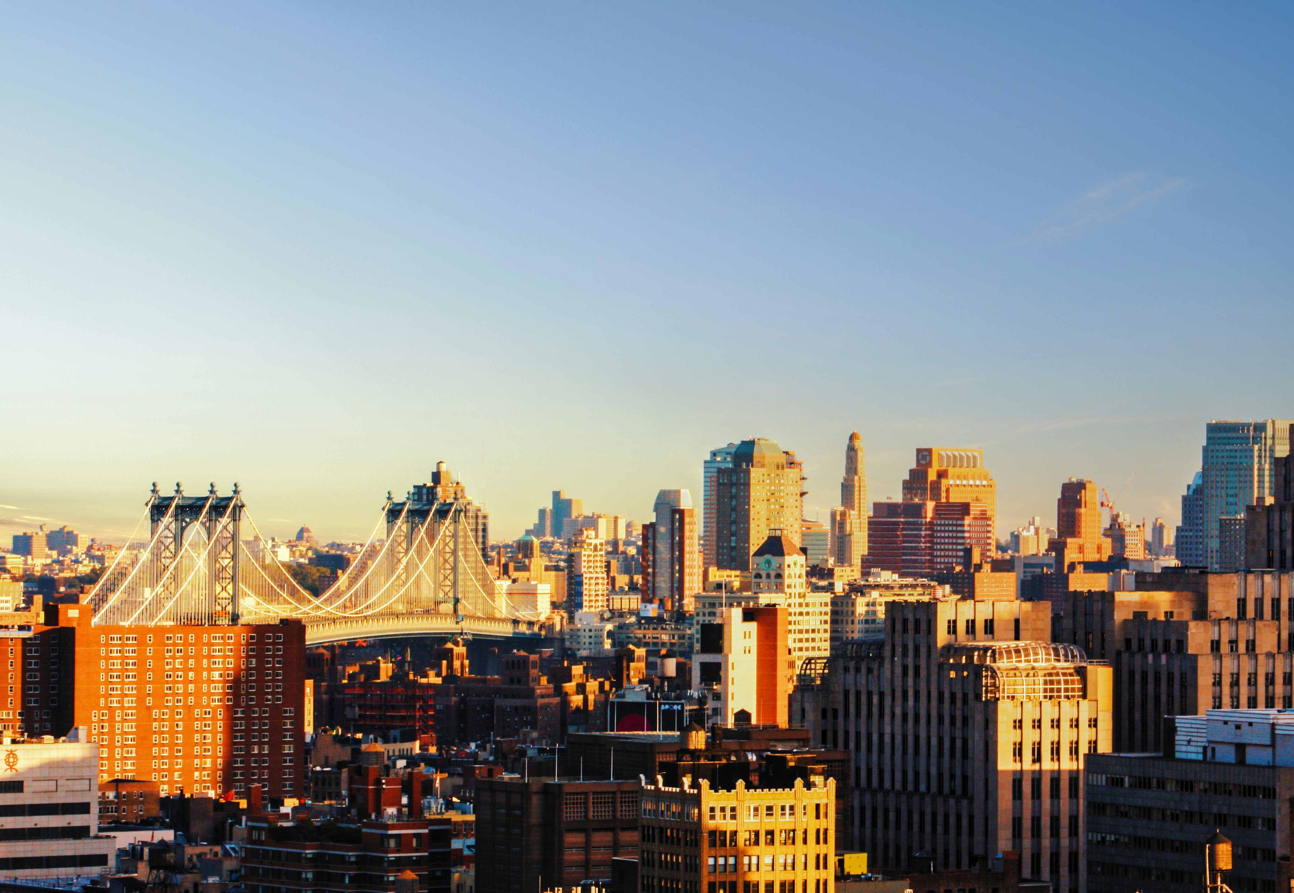 Dawn Over the City: Bridges and Towers Weave a Golden Skyline