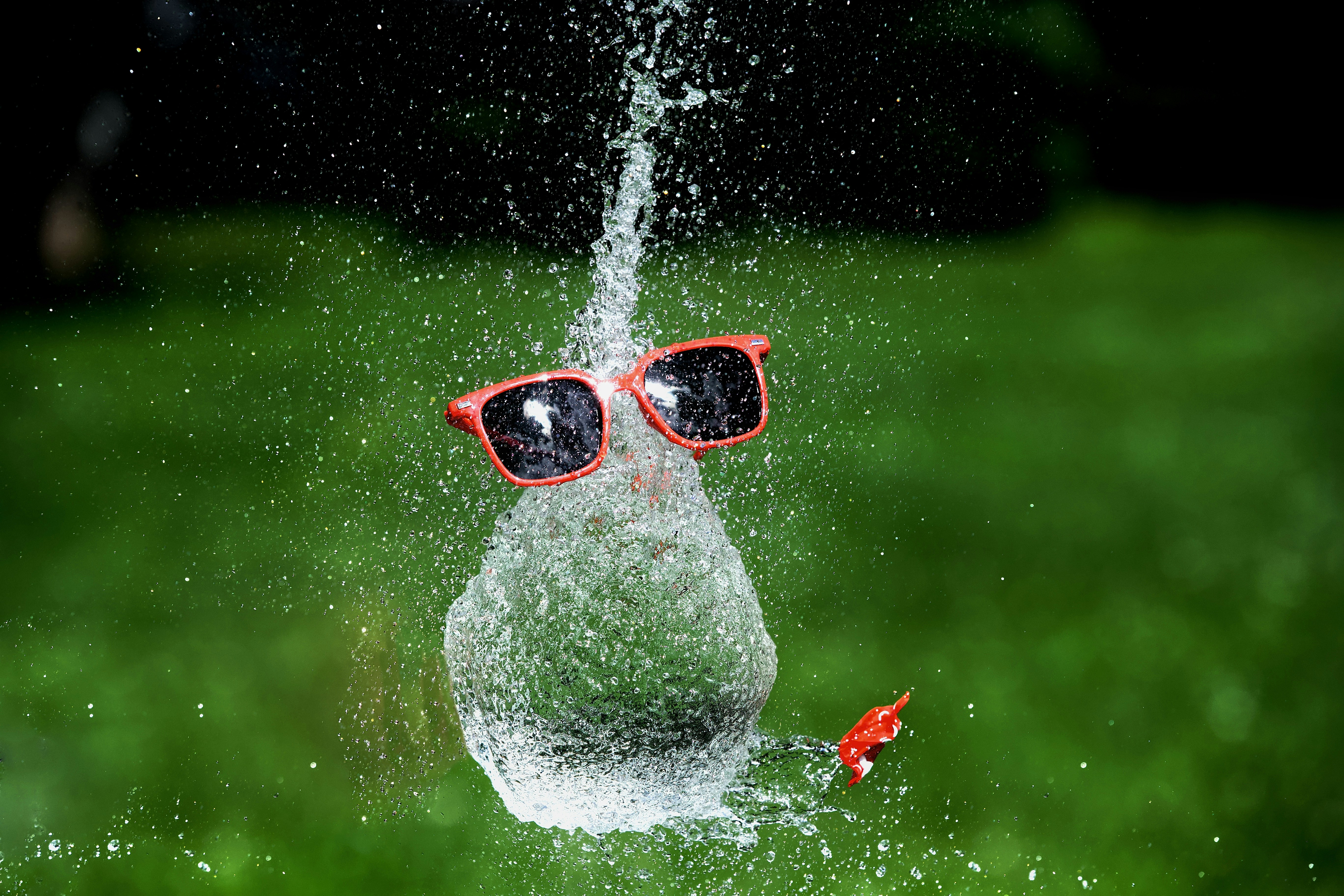 water splash with red framed sunglasses
